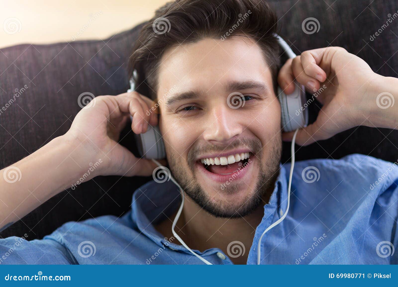 Young man enjoying music stock image. Image of player - 69980771