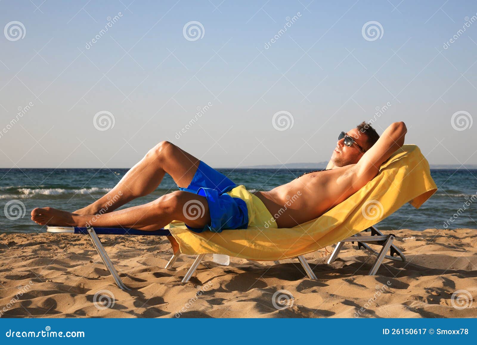 Young man enjoying the sun stock image. Image of liquid - 26150617