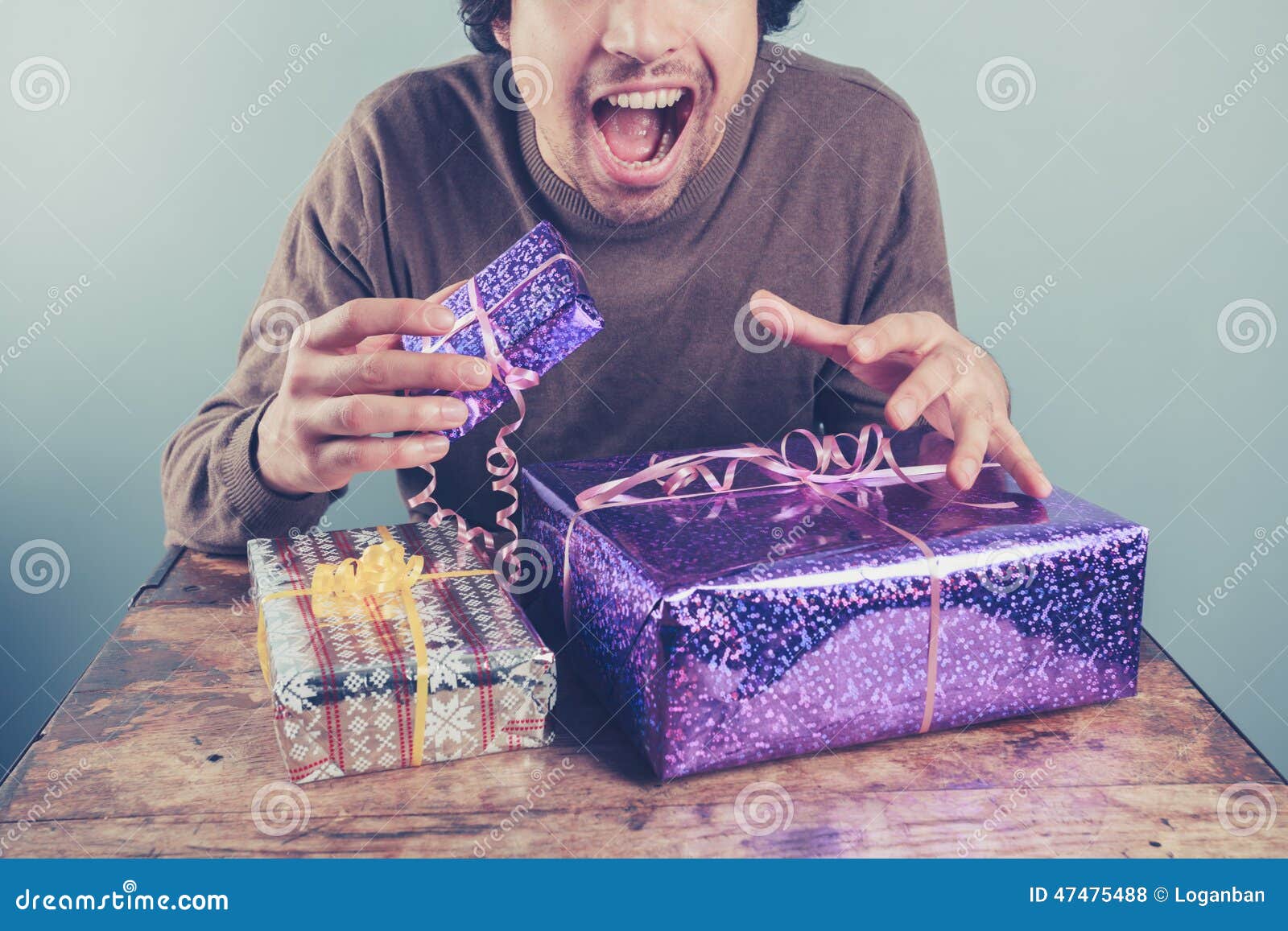 Young Man Excited about His Presents Stock Photo - Image of present ...