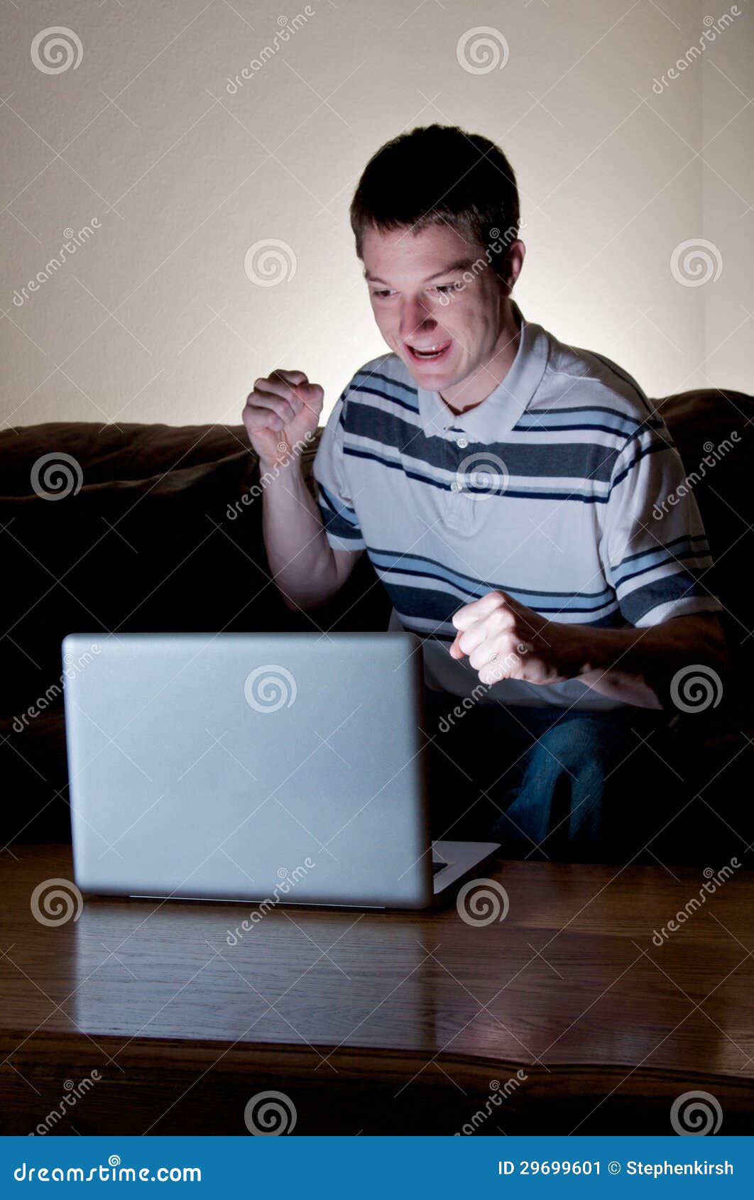Young Man Excited by News on His Computer Stock Image - Image of ...