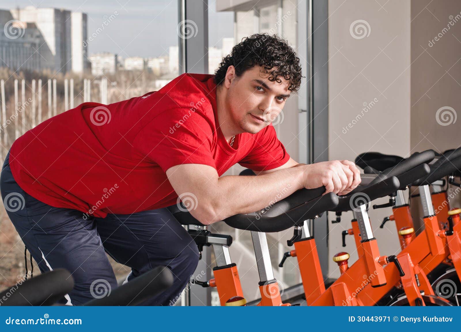 Young Man on Exercise Bicycle Stock Image - Image of human, club: 30443971