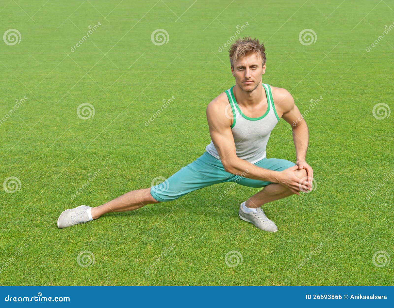 Young Man Exercising on Green Field Stock Photo - Image of athletic ...