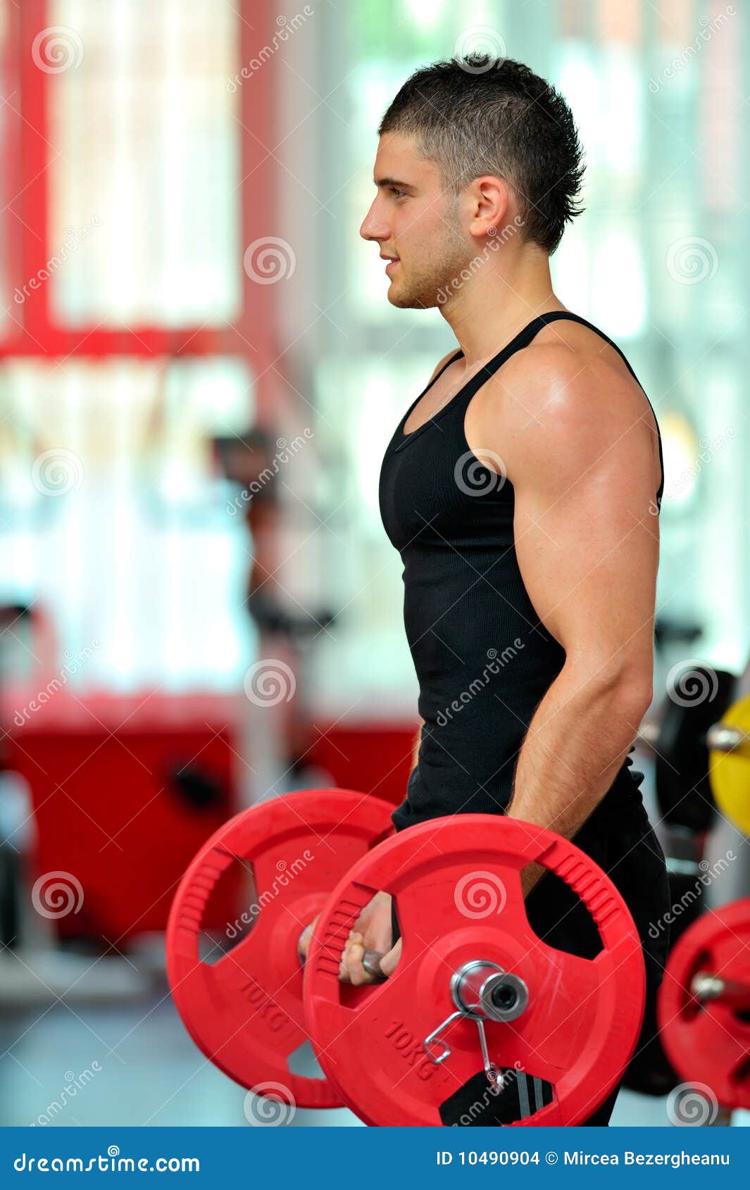 Young Man Exercising in the Gym Stock Photo - Image of shape ...