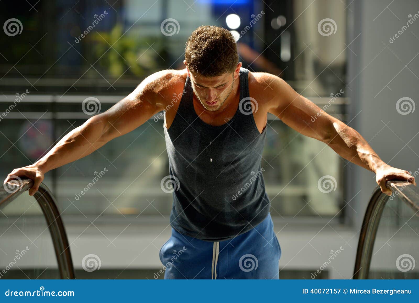 Young Man Exercising in the Gym Stock Image - Image of athletic, sport ...