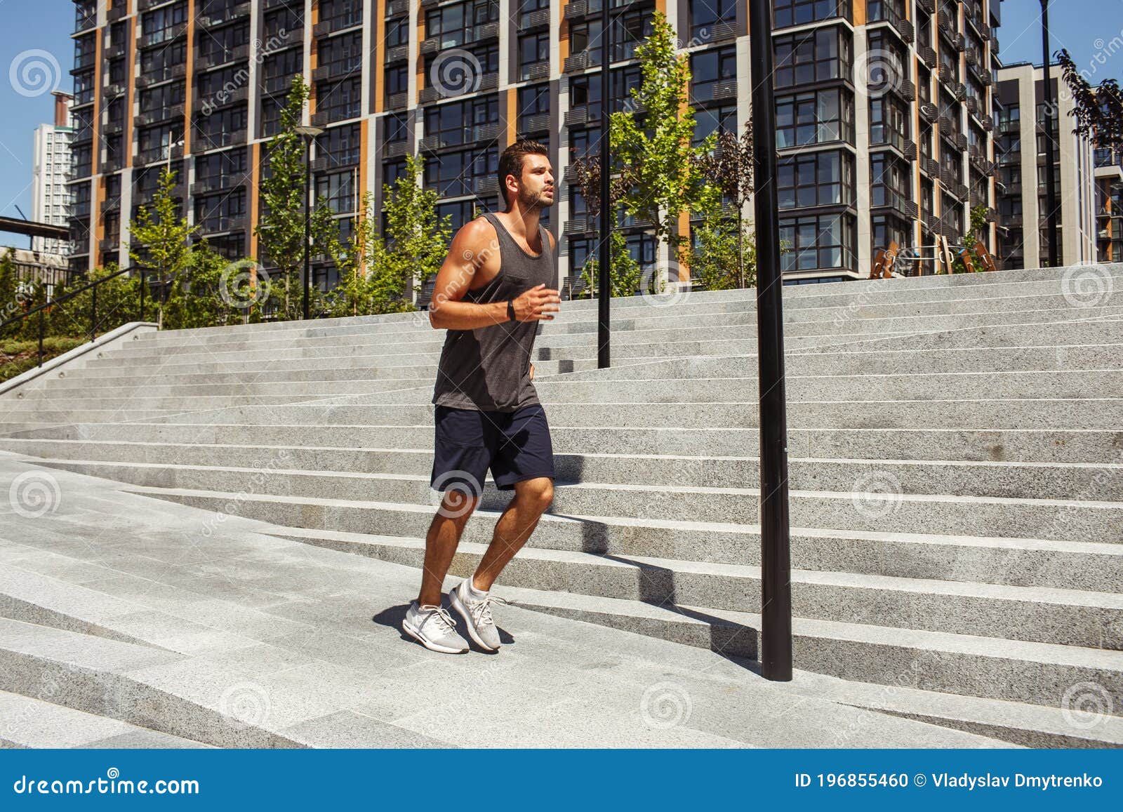 Young Man Exercising Outside. Guy Jogging or Slow Running Besides Steps ...