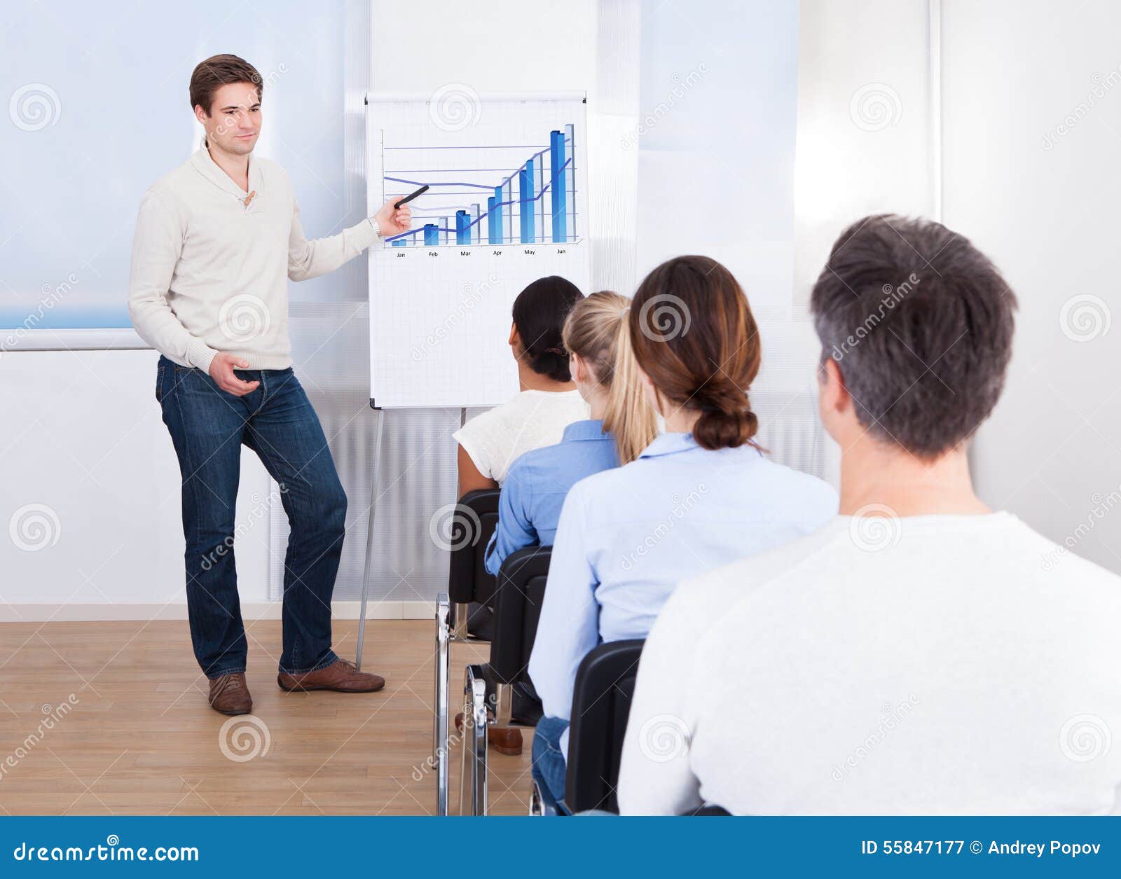 Young Man Explaining Graph stock image. Image of giving - 55847177