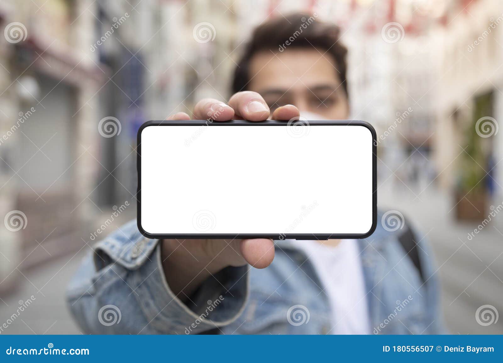 Young Man Extending His Smart Phone To the Camera Stock Image - Image ...