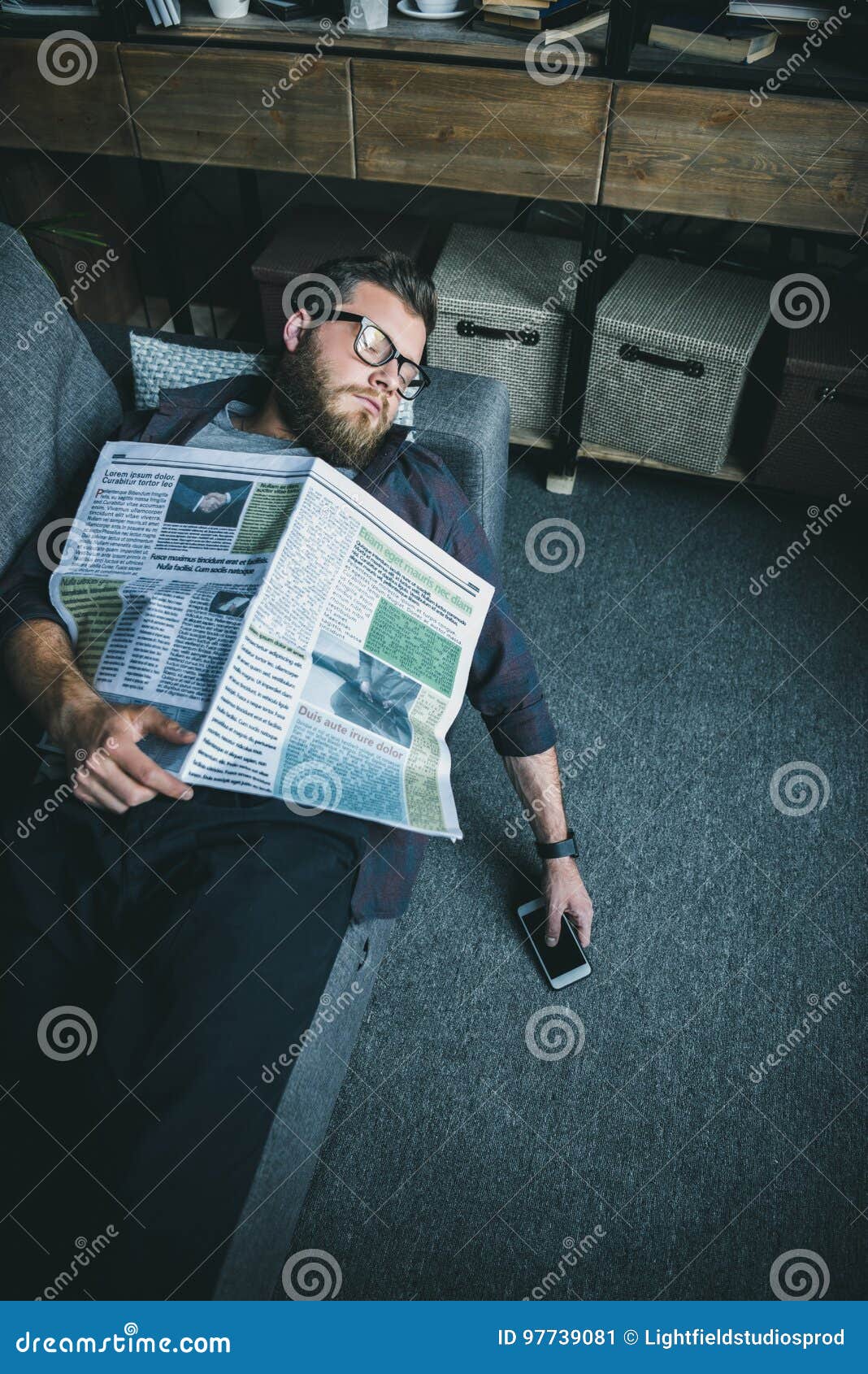 Young Man in Eyeglasses Sleeping with Newspaper on Sofa at Home Stock ...