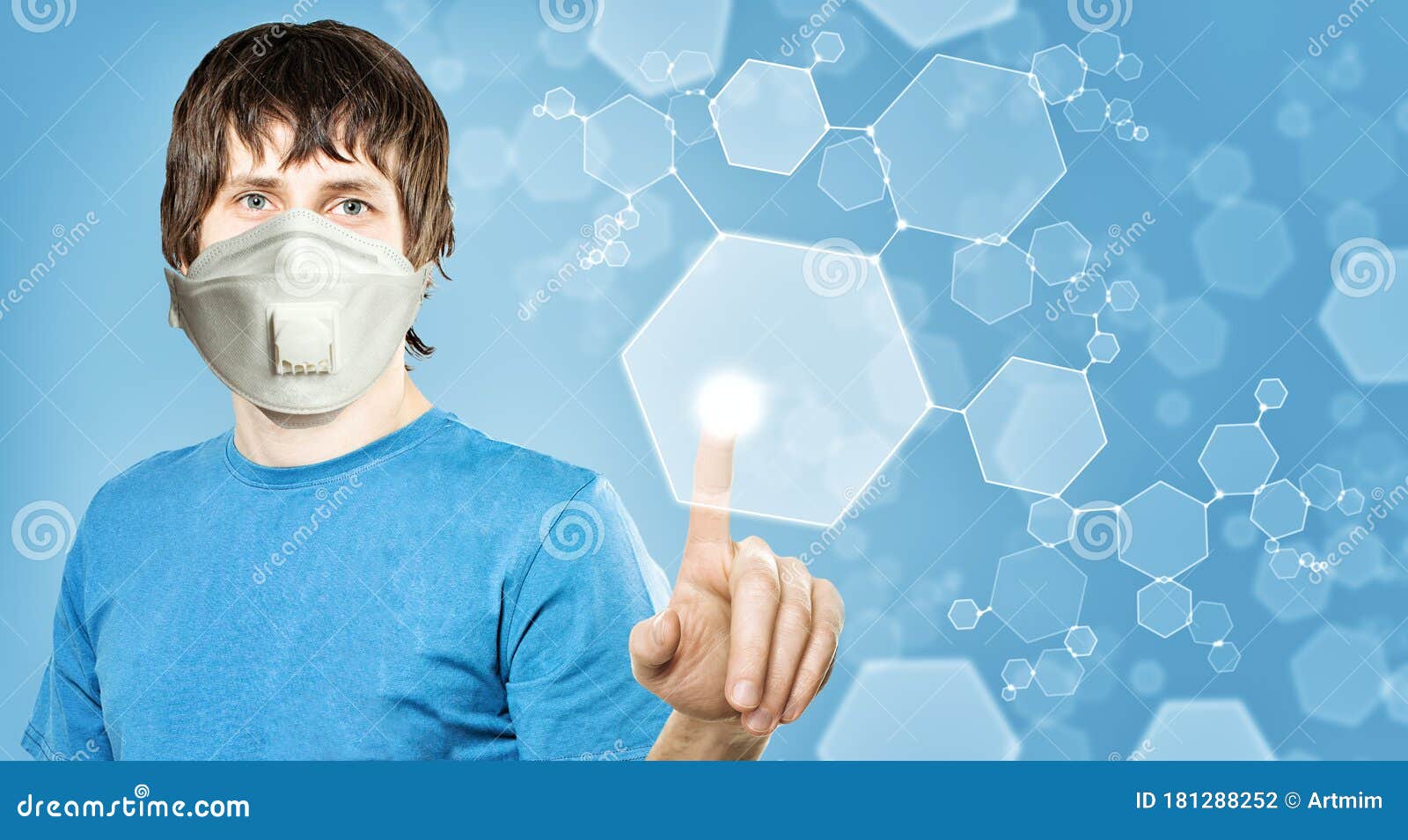 Young Man in a Face Mask Using Virtual Digital Technology Stock Photo ...