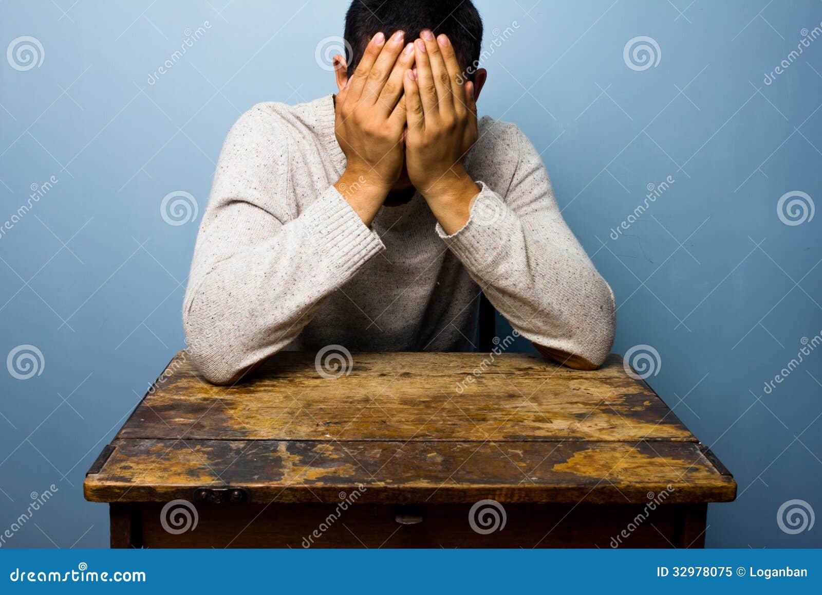 Young Man Face Palming at Desk Stock Image - Image of helpless, face ...