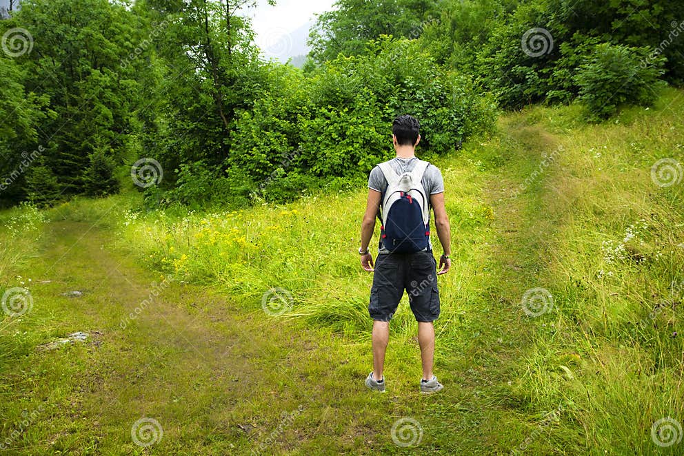 Young Man Facing Choice between Two Different Path Stock Image - Image ...