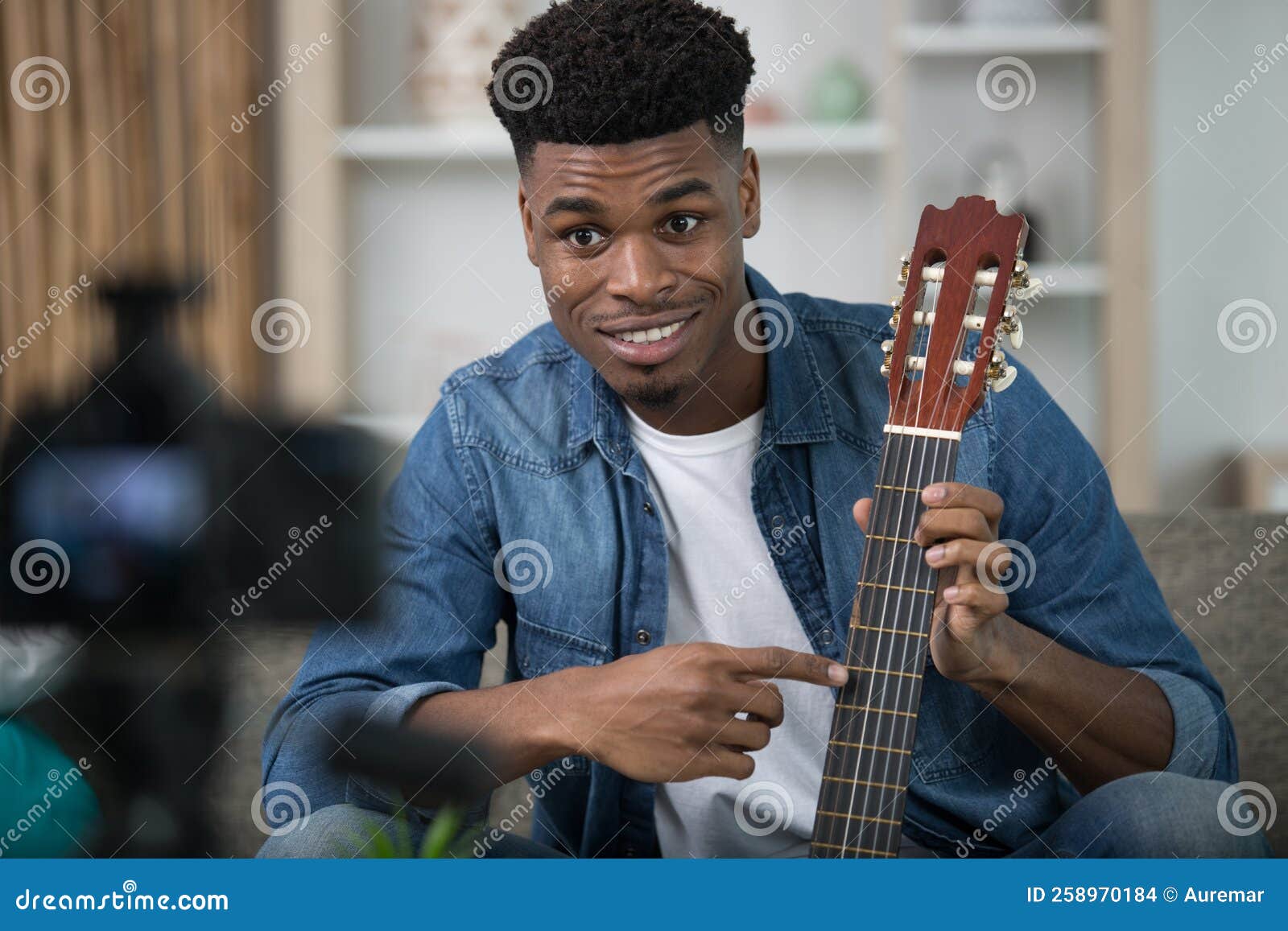 Young Man Filming Guitar Tutorial on Camera Stock Photo - Image of ...