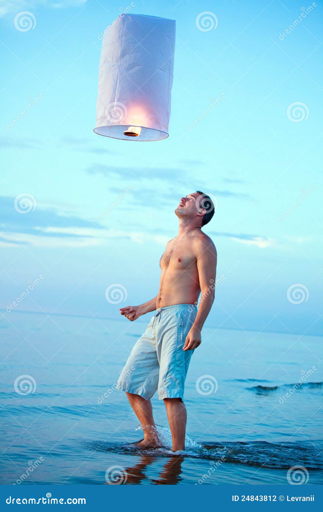 A Young Man with a Fire Lantern Stock Photo - Image of balloon, male ...