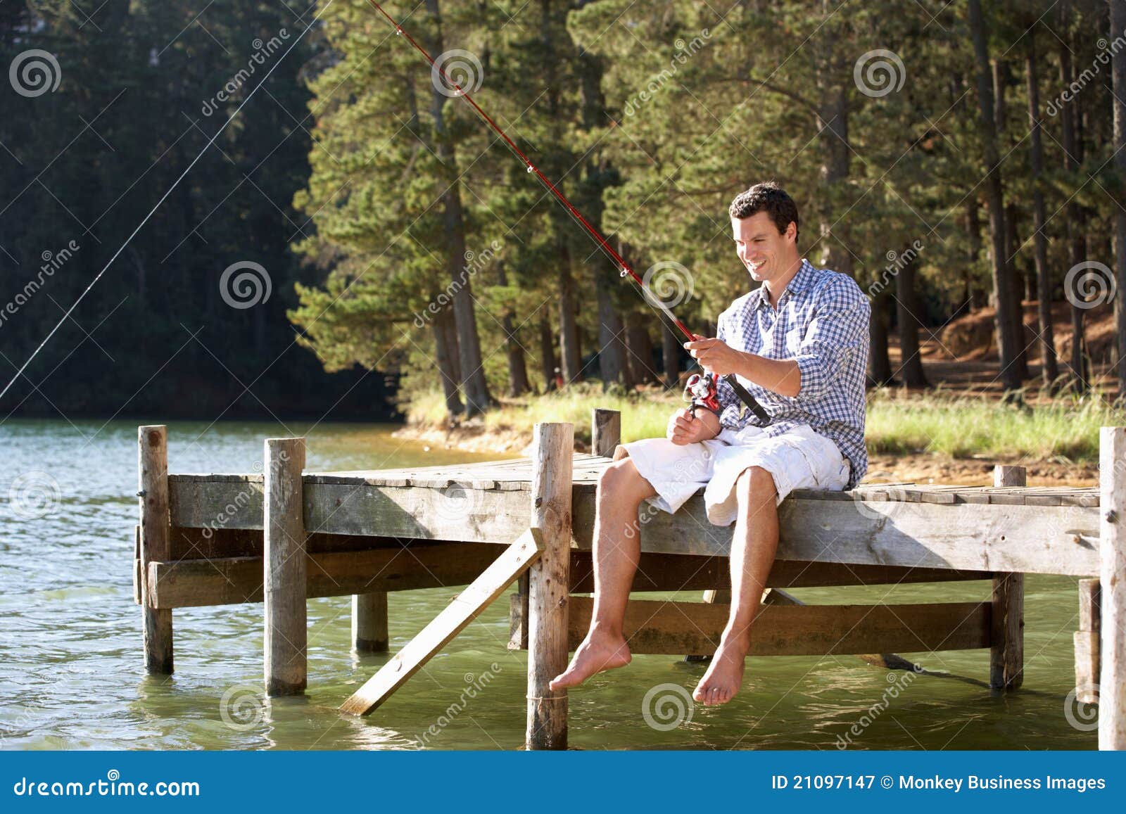 Young man fishing stock image. Image of relaxed, leisure - 21097147