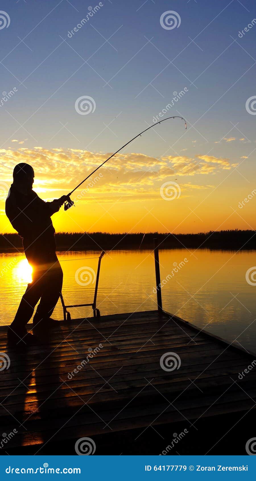 Young Man Fishing on a Lake at Sunset Stock Image - Image of people ...