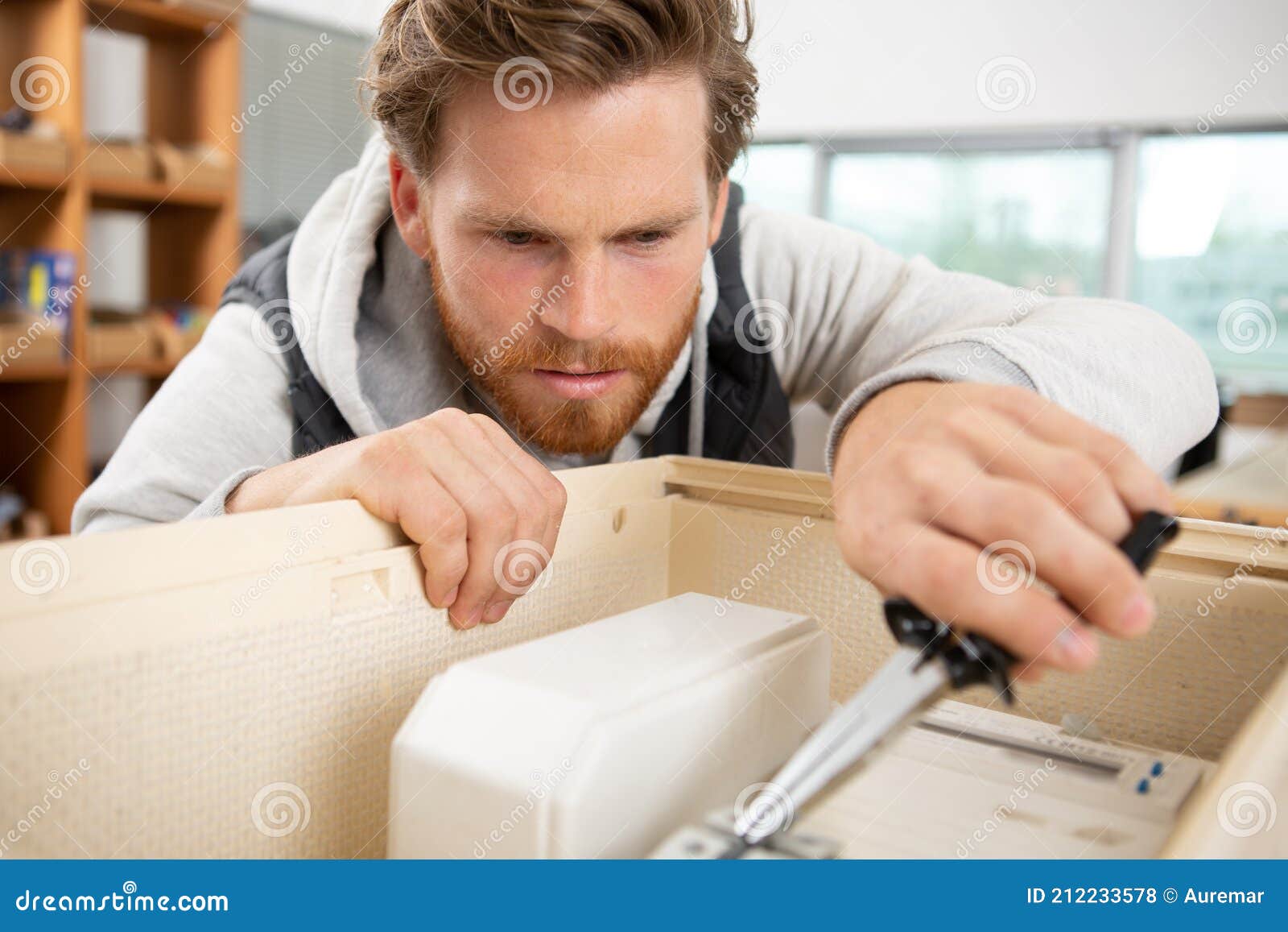 Young man fixing box stock photo. Image of electric - 212233578