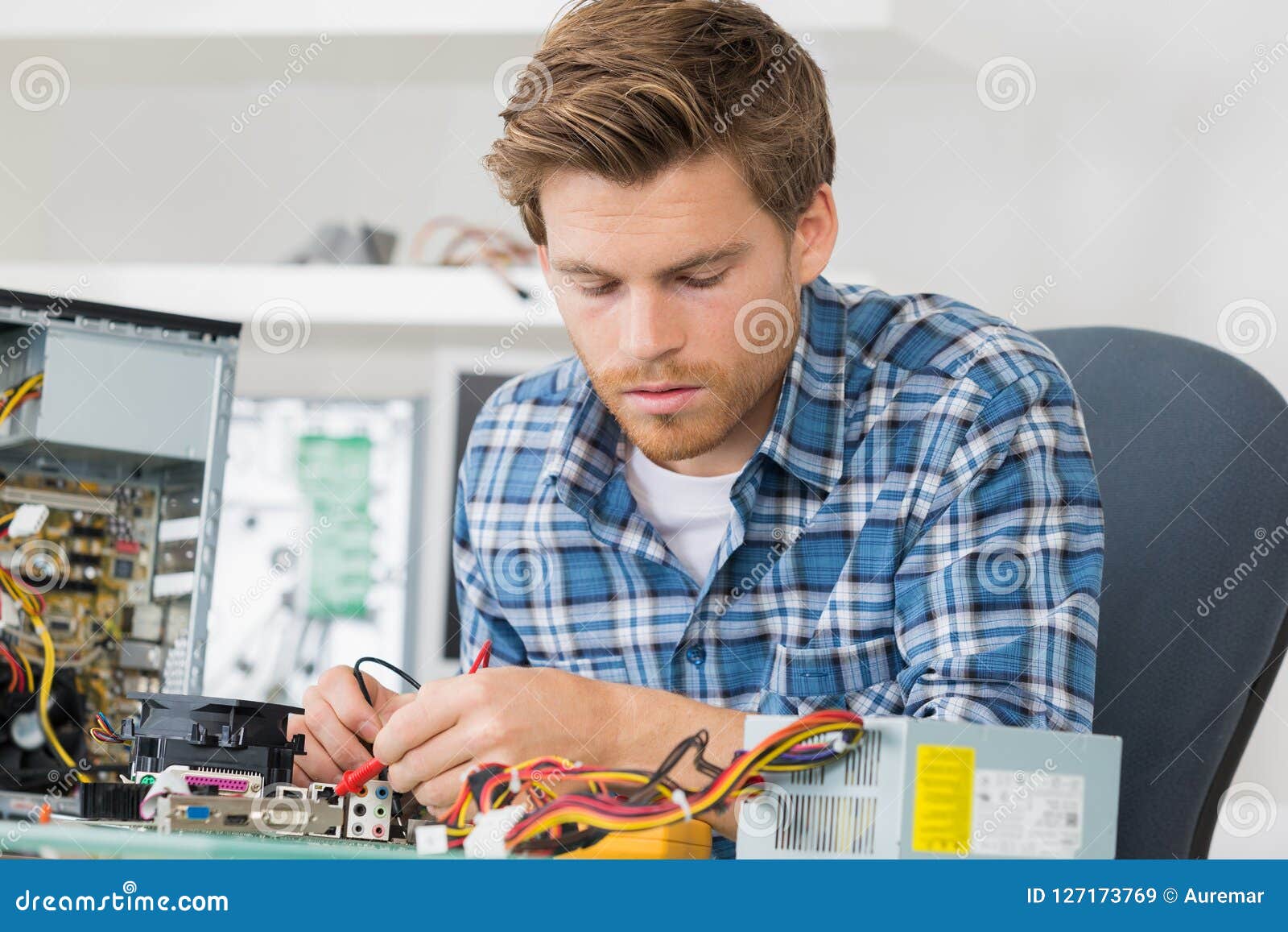Young man fixing computer stock image. Image of connection - 127173769