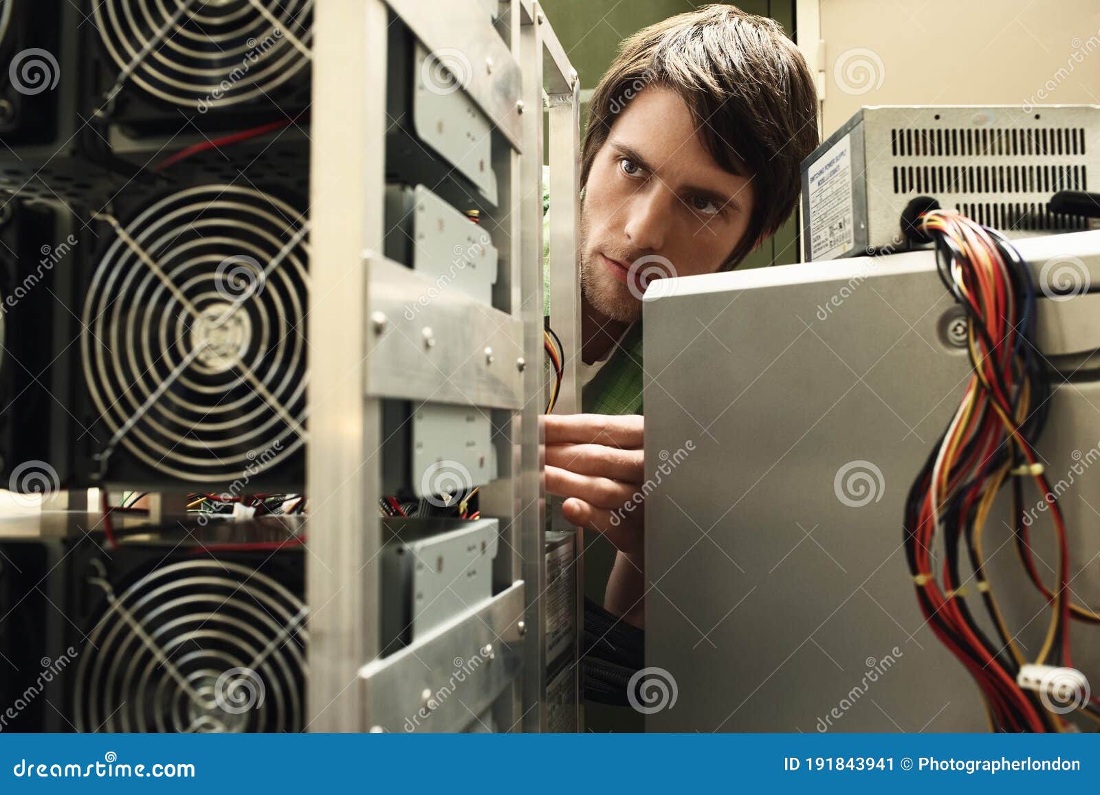 Young Man Fixing Computer Equipment Stock Image - Image of young ...