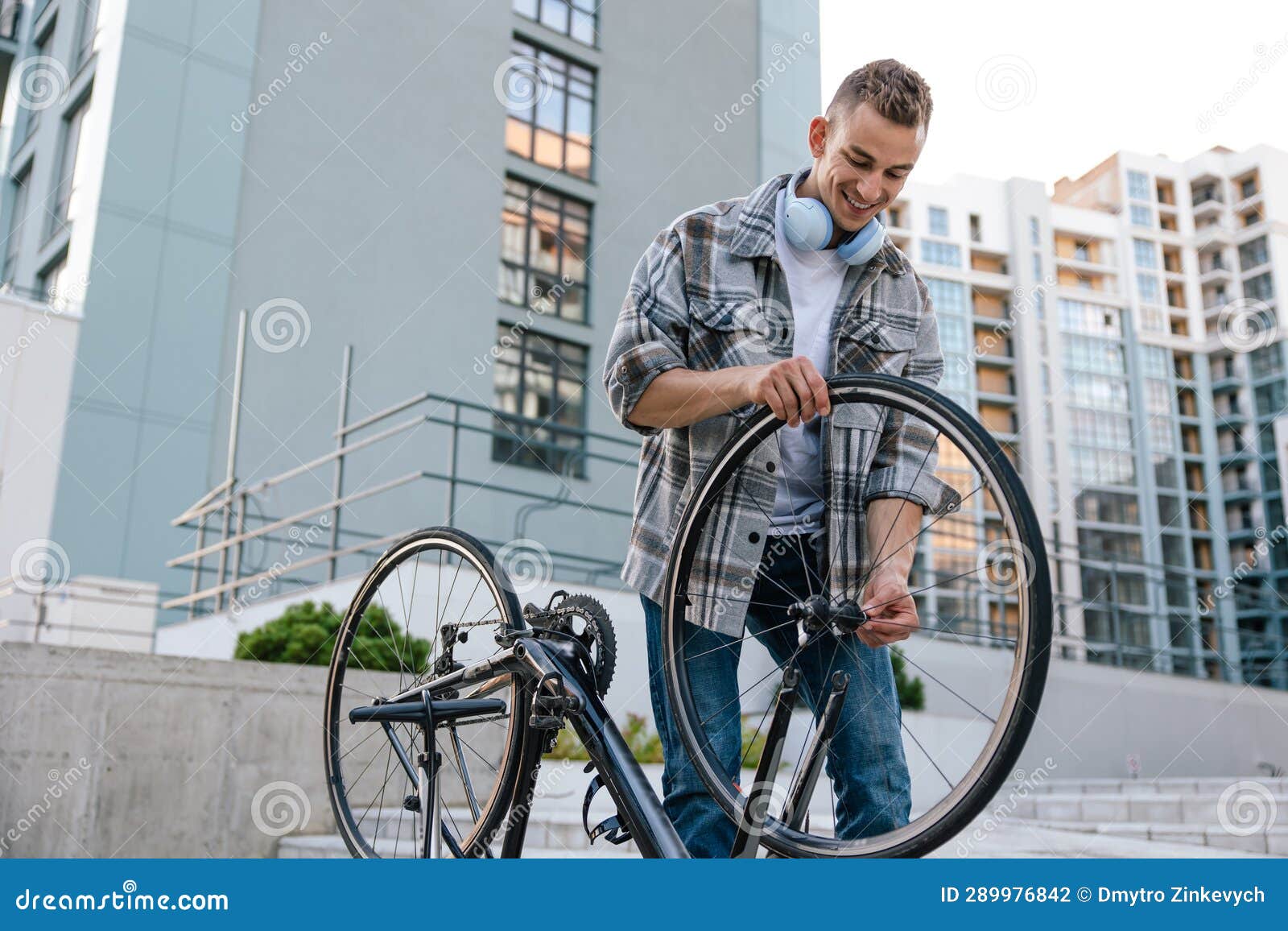 Young Man Fixing a Problem with the Tire Stock Photo - Image of vehicle ...