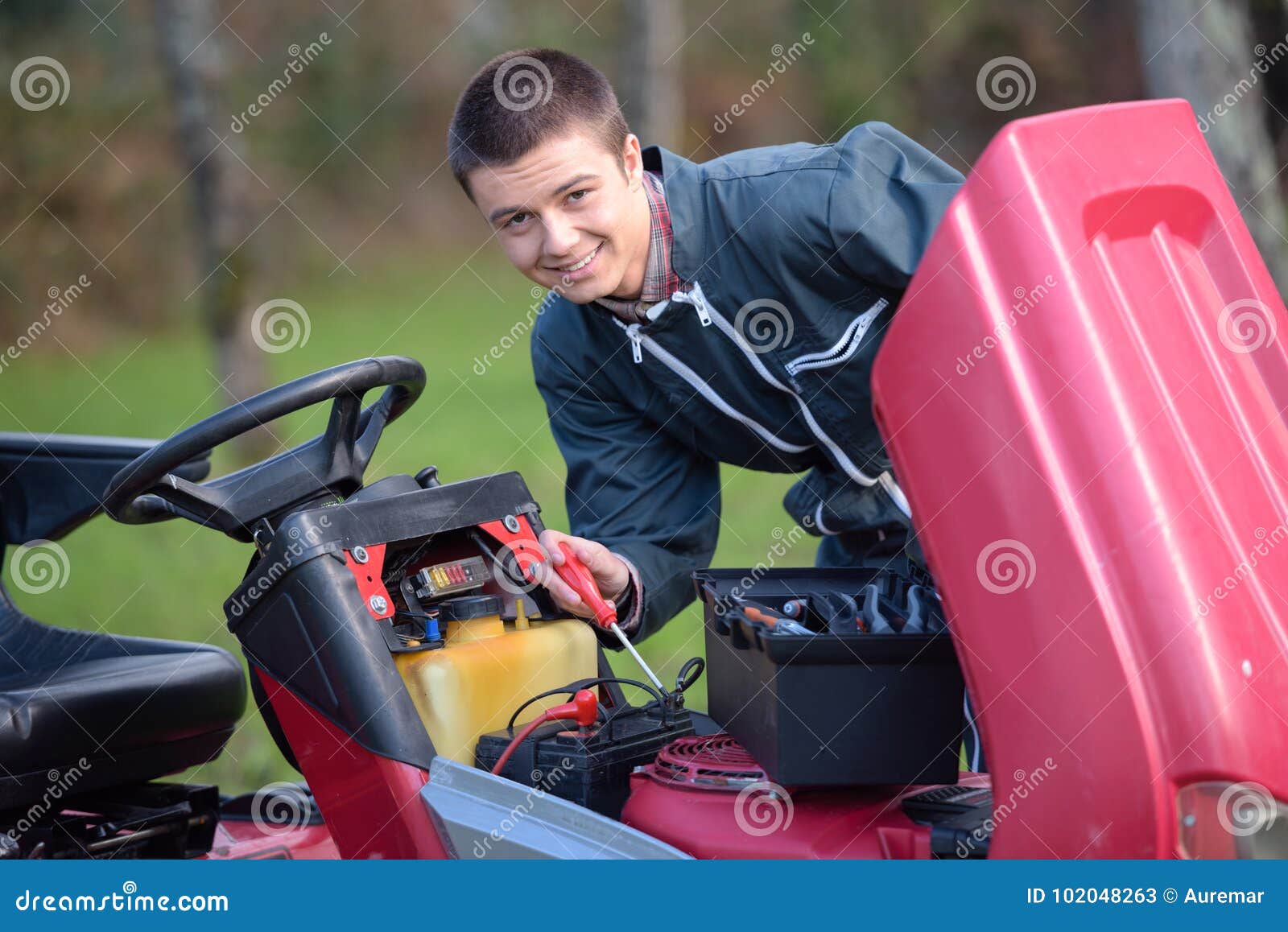 Man Fixing Old Tractor Stock Photo | CartoonDealer.com #28536786