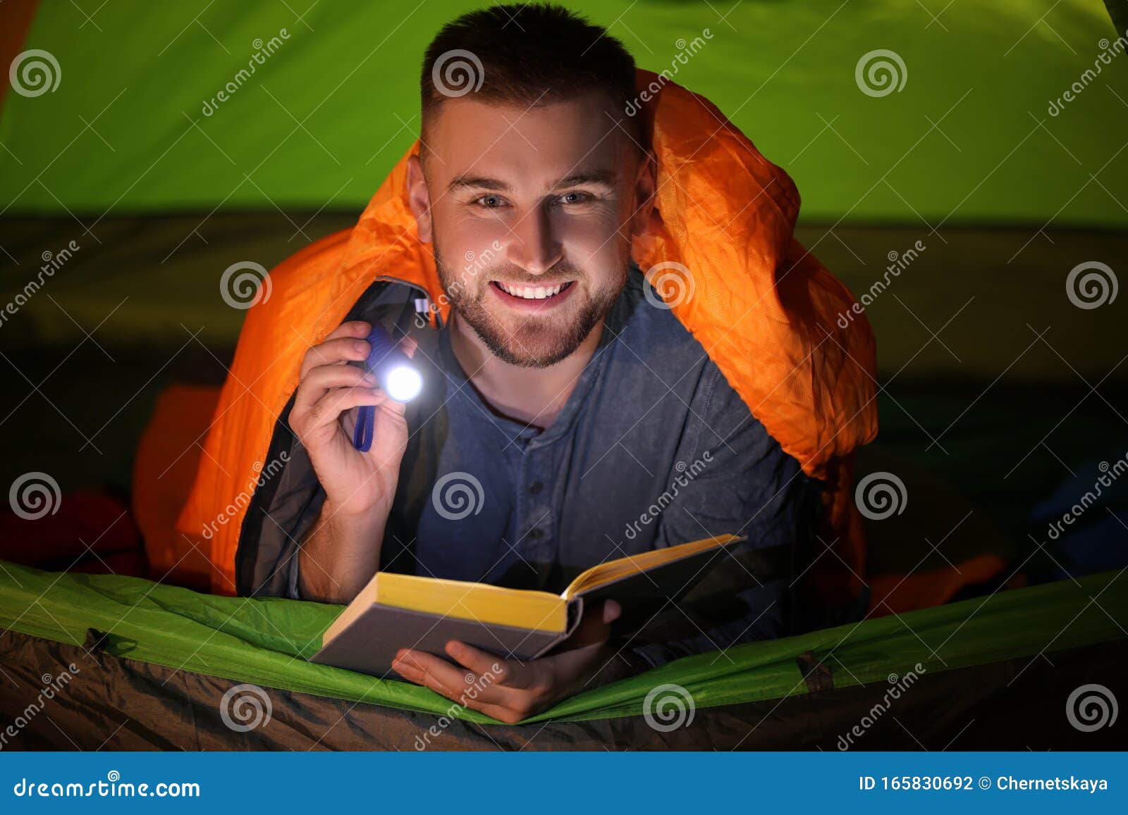 Young Man with Flashlight Reading Book Stock Photo - Image of novel ...