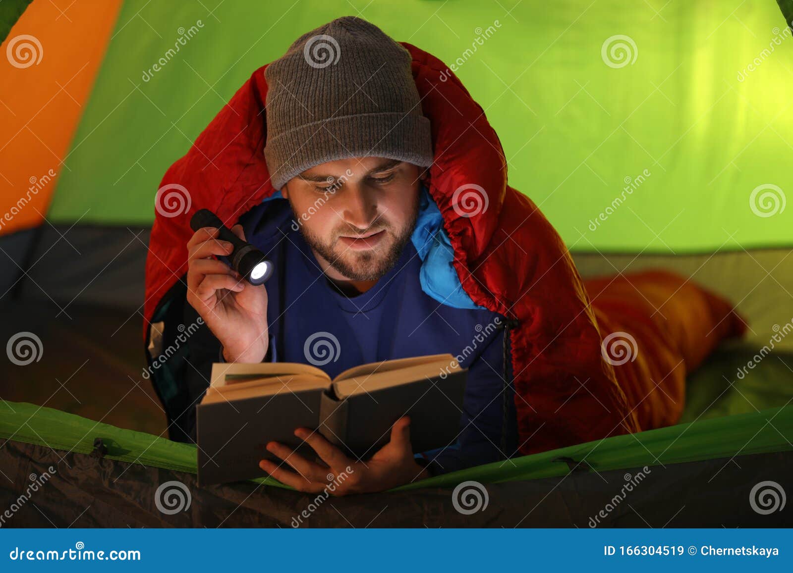 Young Man with Flashlight Reading Book Stock Image - Image of caucasian ...