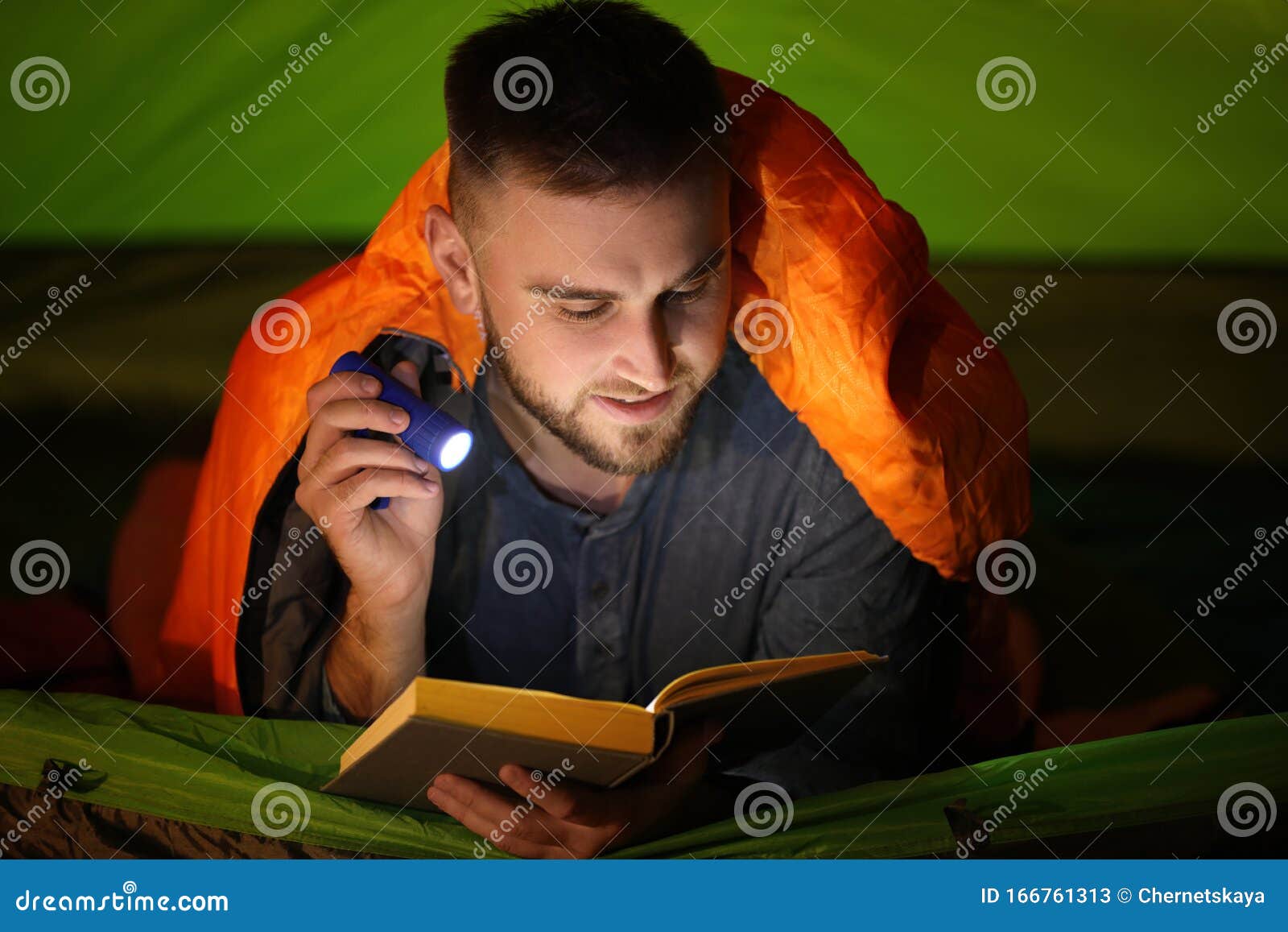Young Man with Flashlight Reading Book Stock Image - Image of inside ...