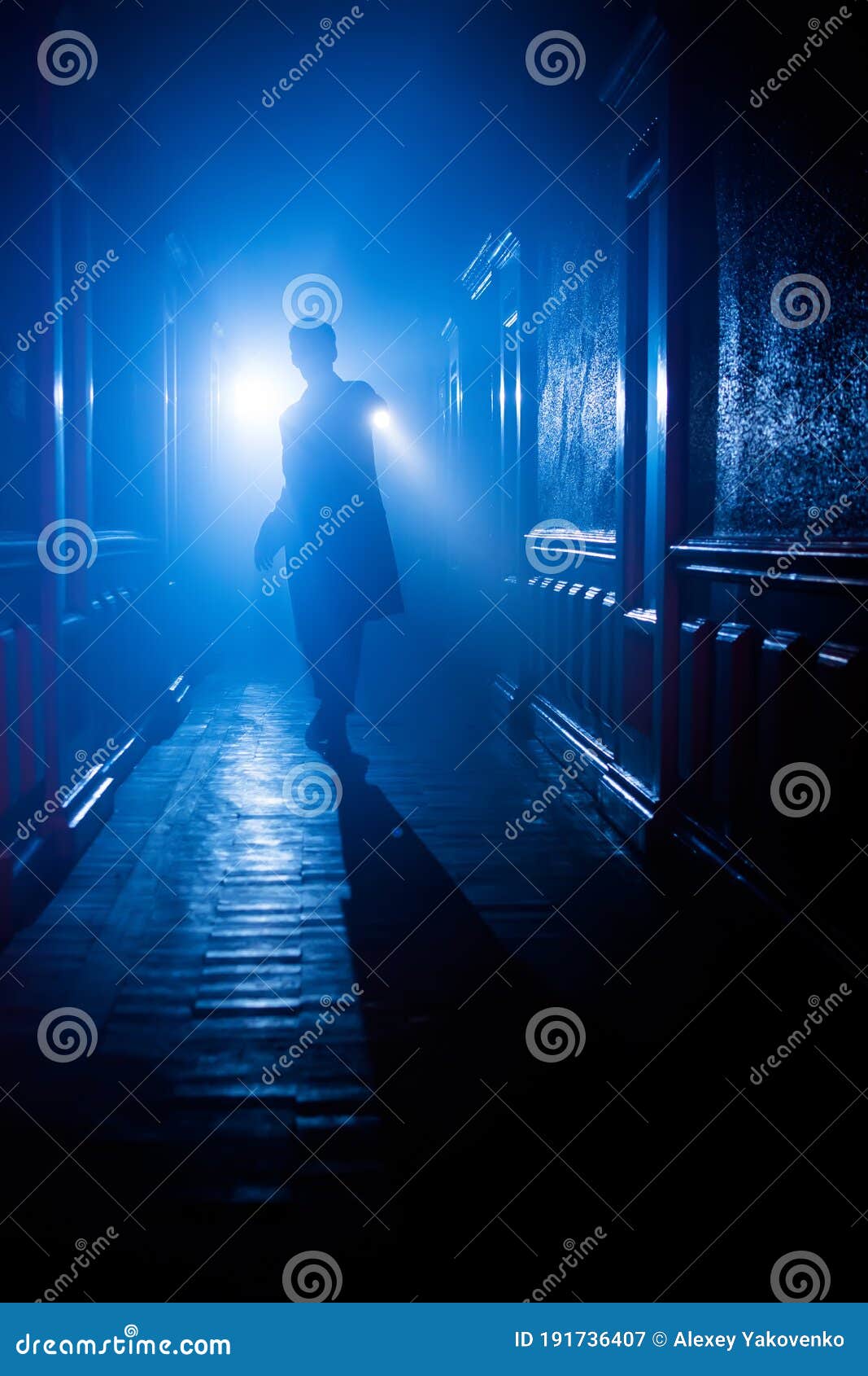 A Young Man with Flashlight in Tha Hallway. Behind the Scenes of ...