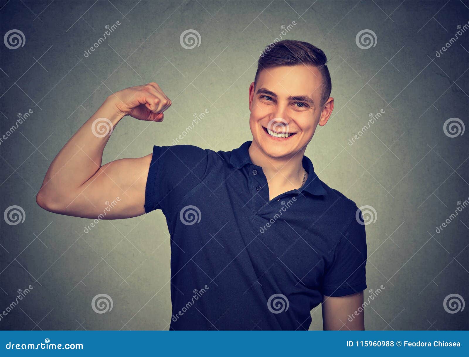 Young Man Flexing His Bicep Stock Photo - Image of athletic, body ...
