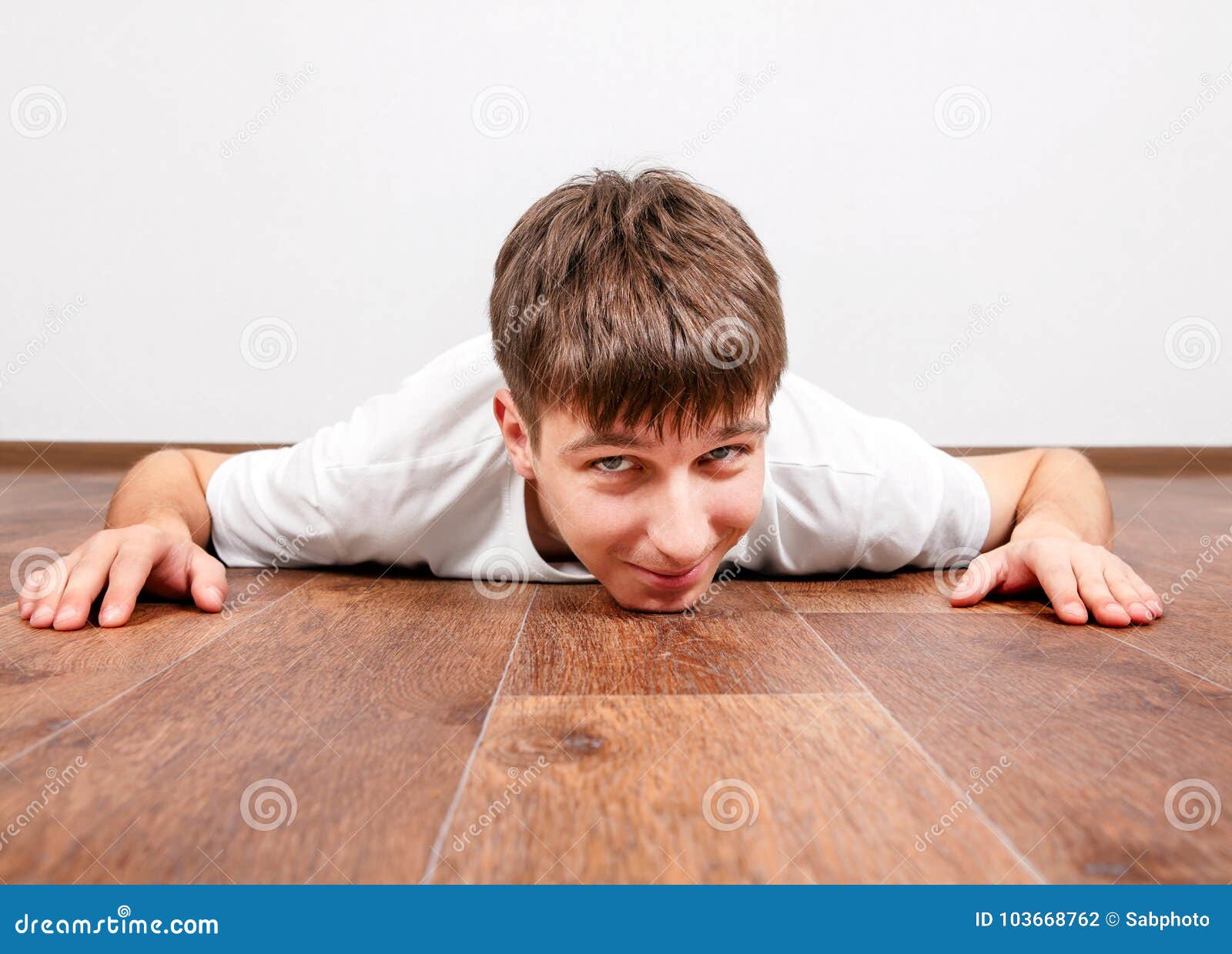 Young Man on the Floor stock photo. Image of person - 103668762