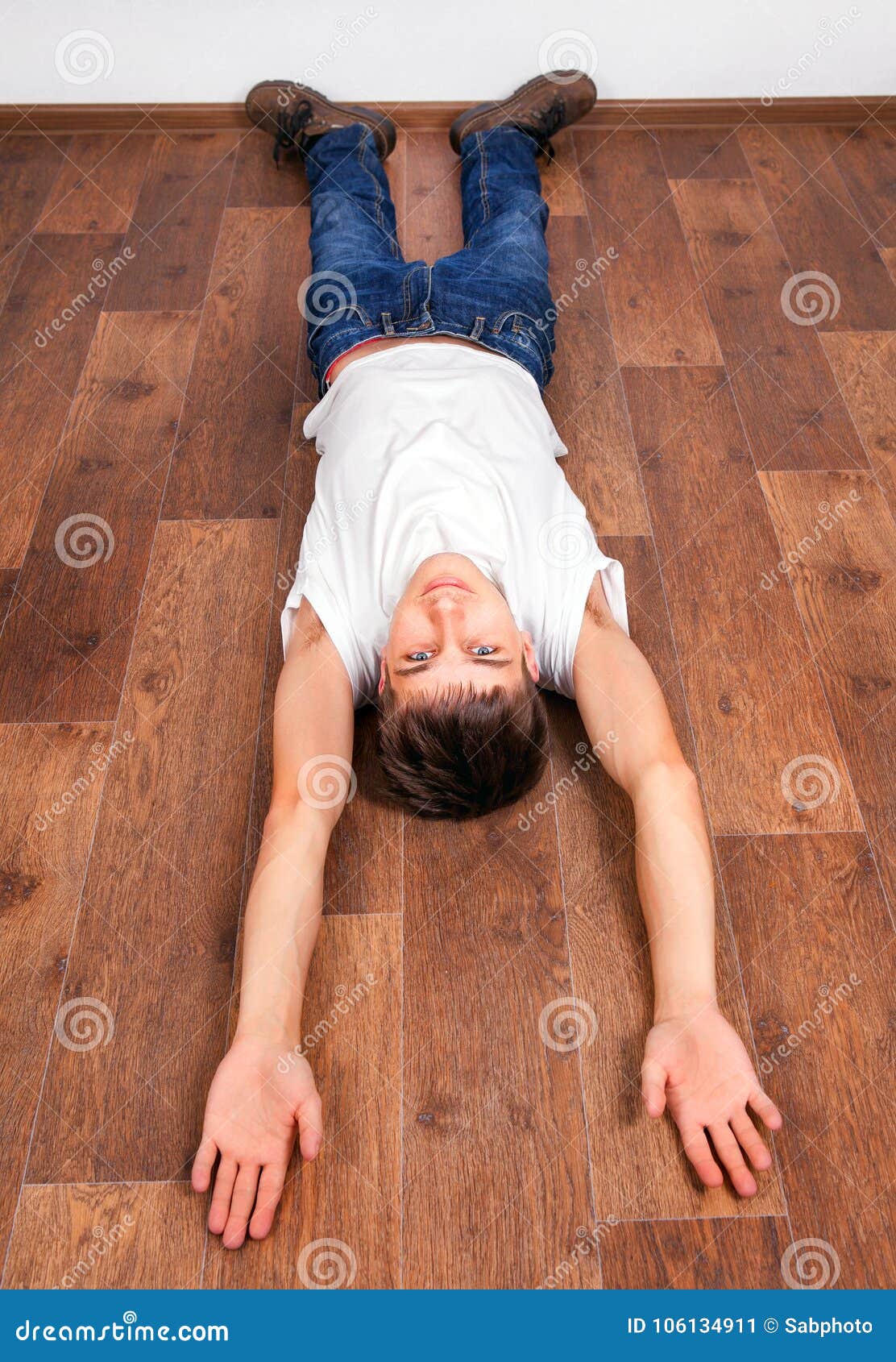 Young Man on the Floor stock image. Image of idle, cute - 106134911