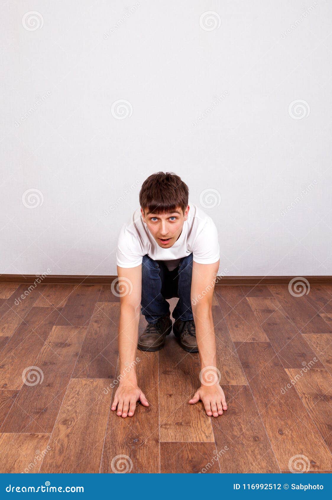 Young Man on the Floor stock photo. Image of positive - 116992512