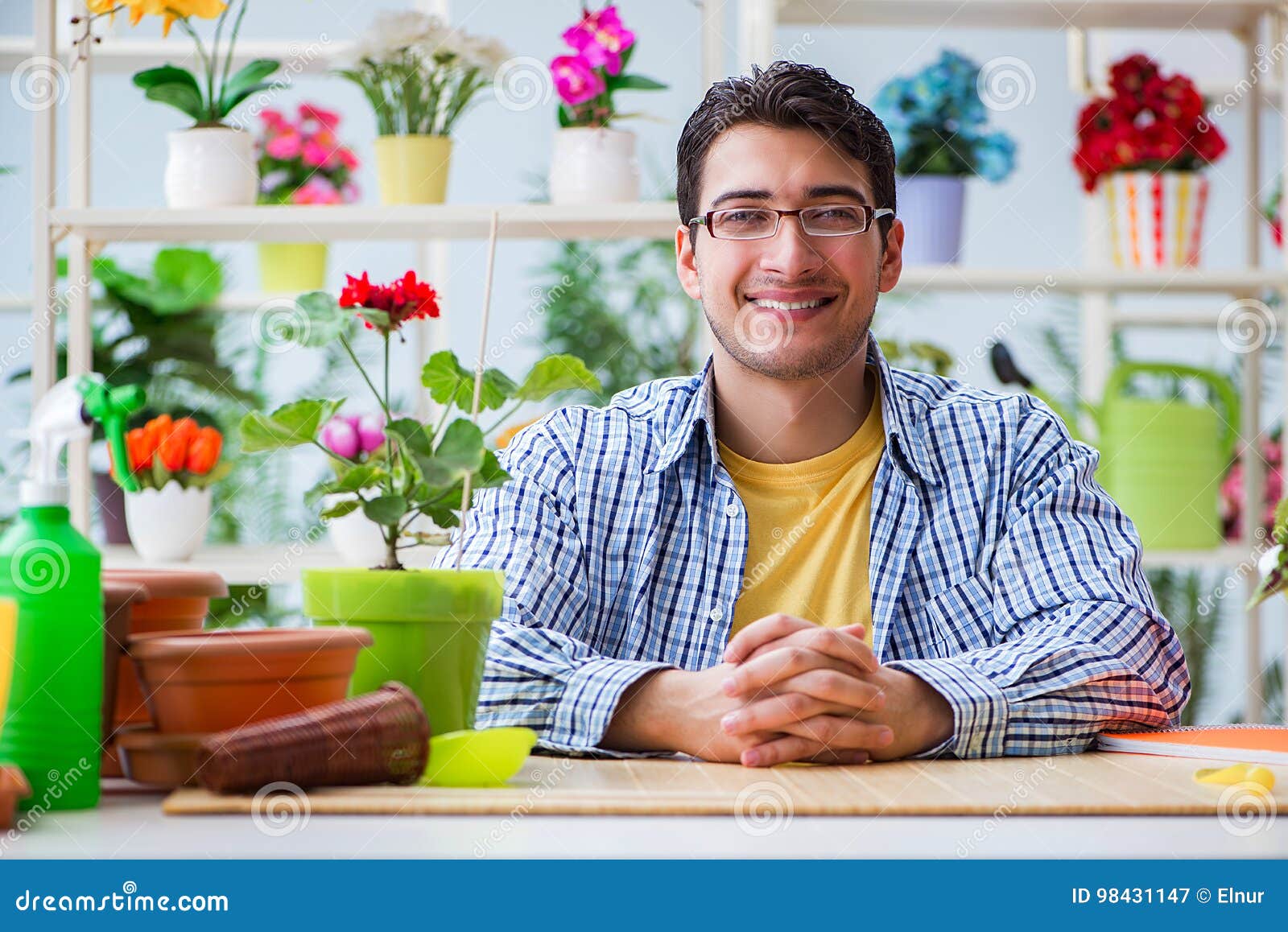 The Young Man Florist Working in a Flower Shop Stock Image - Image of ...