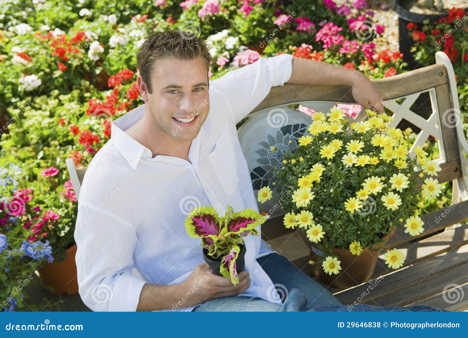 Young Man with Flower Plants at Botanical Garden Stock Photo - Image of ...