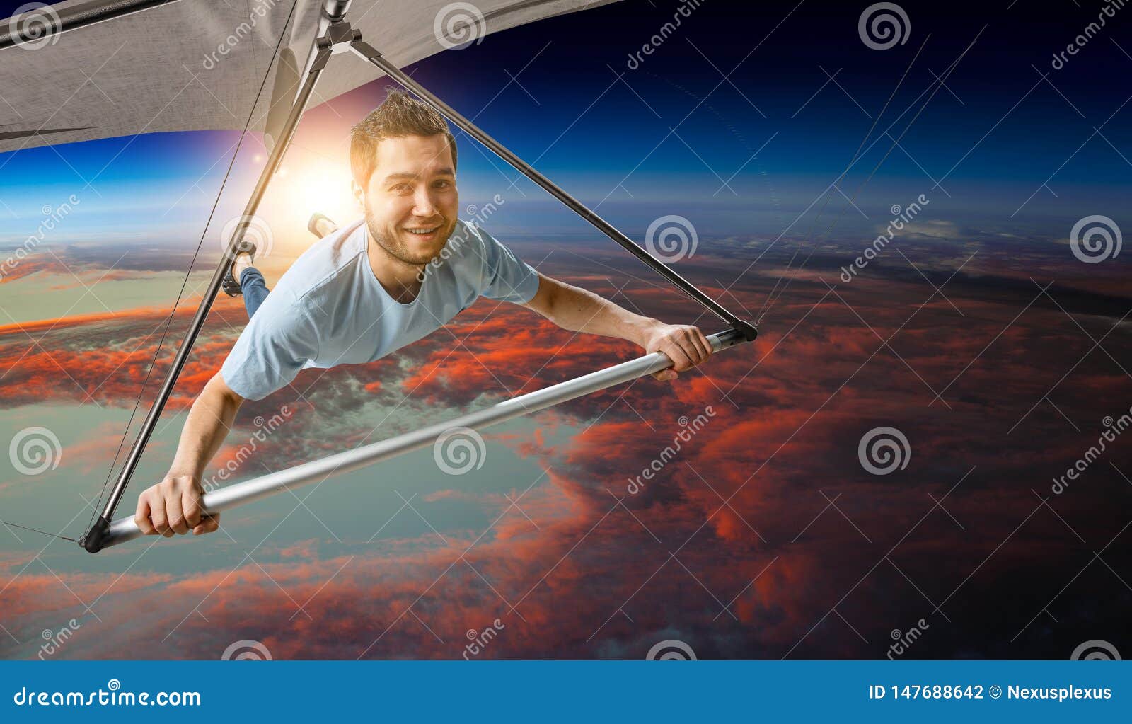 Young Man Flying on Hang Glider. Mixed Media Stock Photo - Image of ...