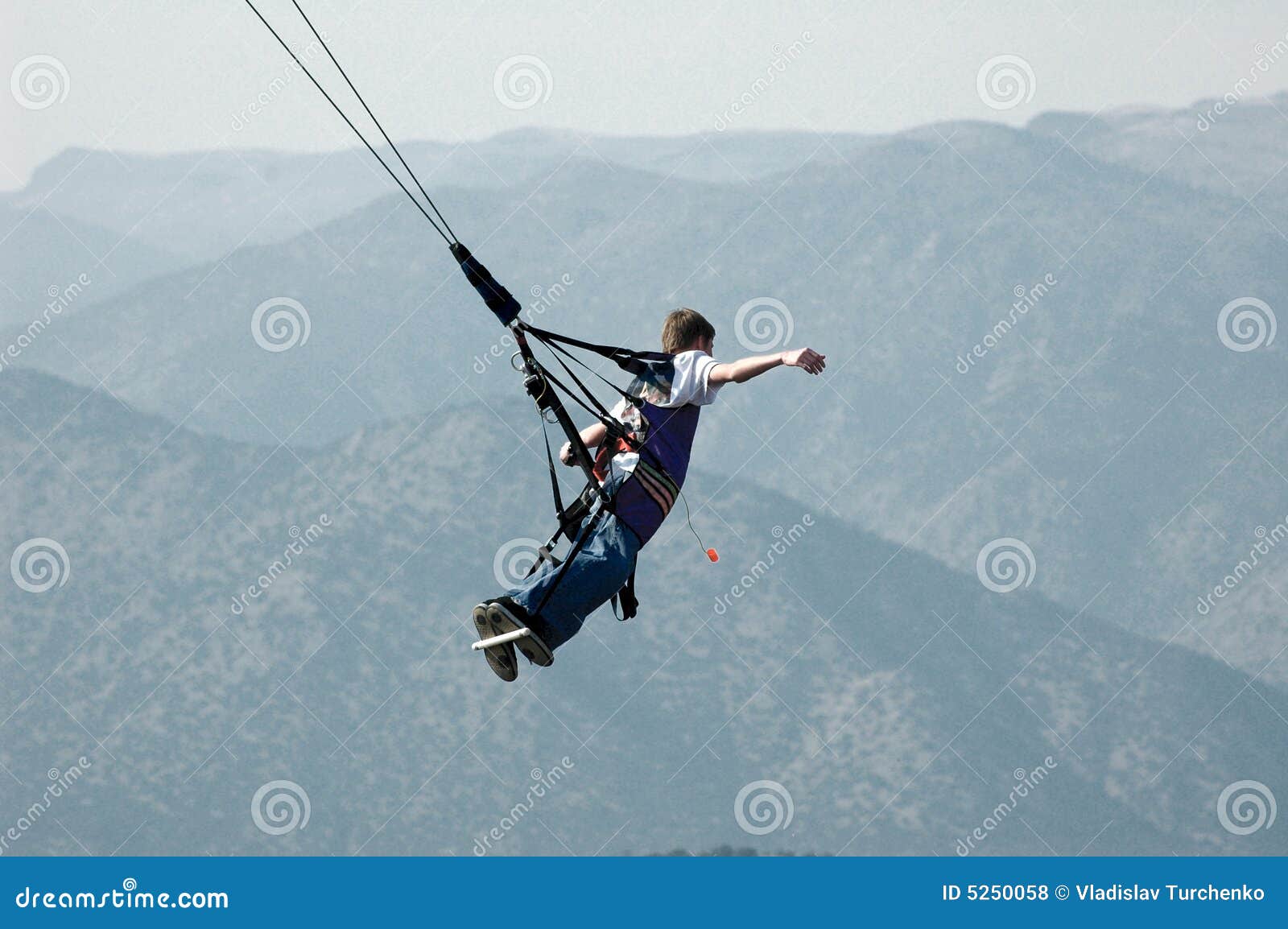 Young Man Flying Over the Mountains Stock Photo - Image of young, ride ...