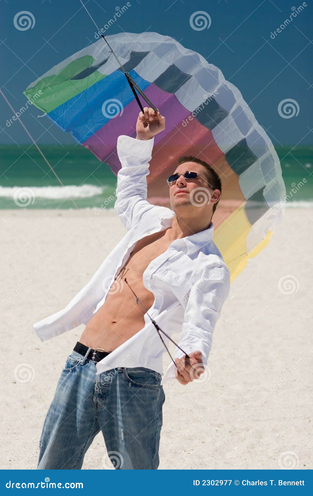 Young Man Flying a Stunt Kite Stock Image - Image of skyhigh, muscular ...