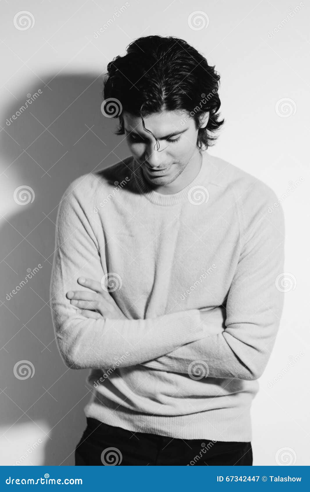 Young Man Folded His Arms and Looking Down. Stock Image - Image of ...