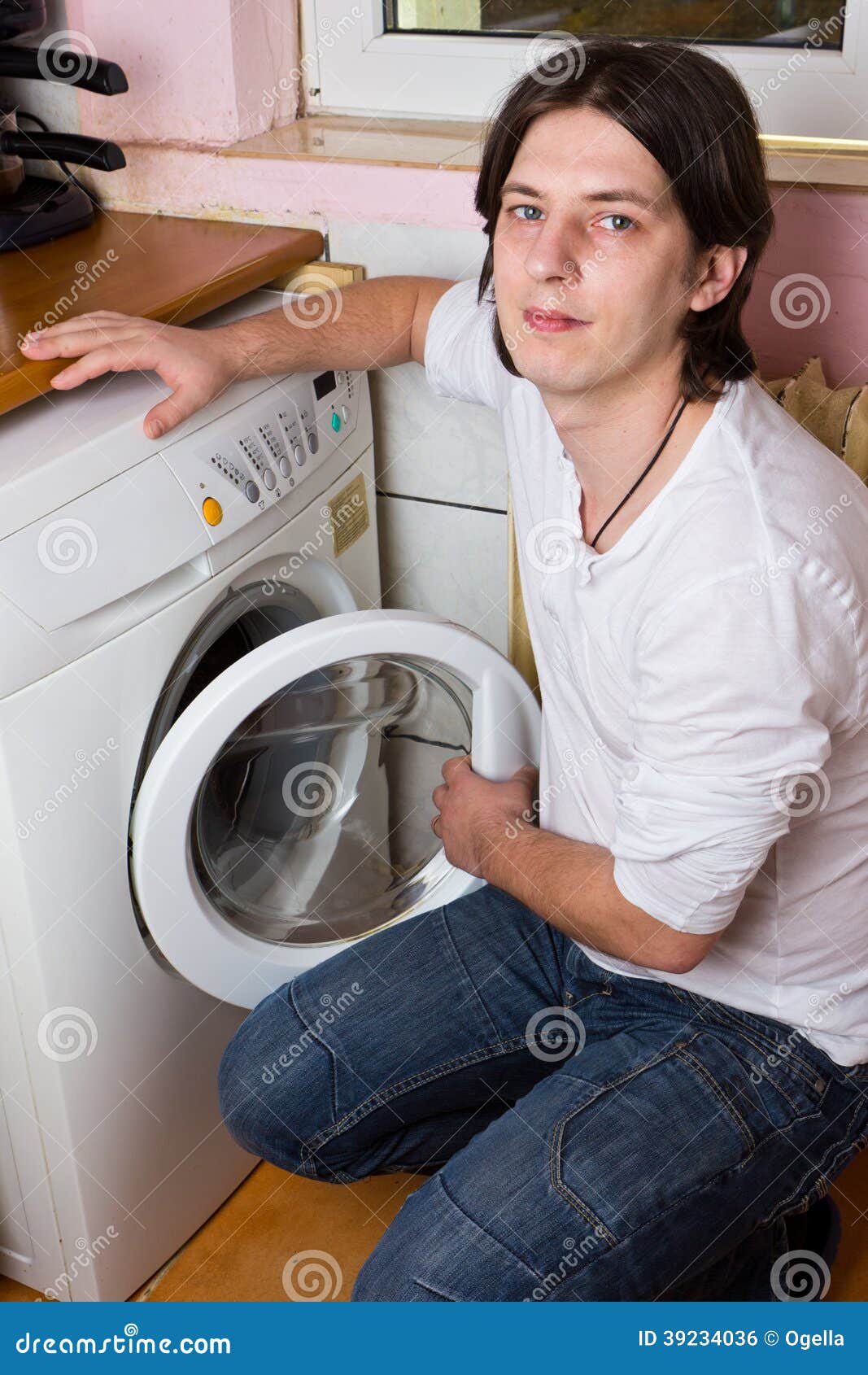 Young Man in Front of Washing Machine Stock Photo - Image of clothes ...
