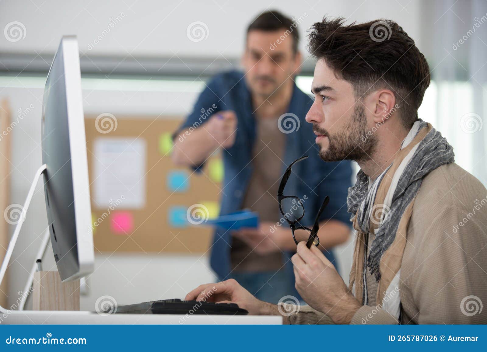 Young Man Frowning while Using Computer Stock Photo - Image of profile ...