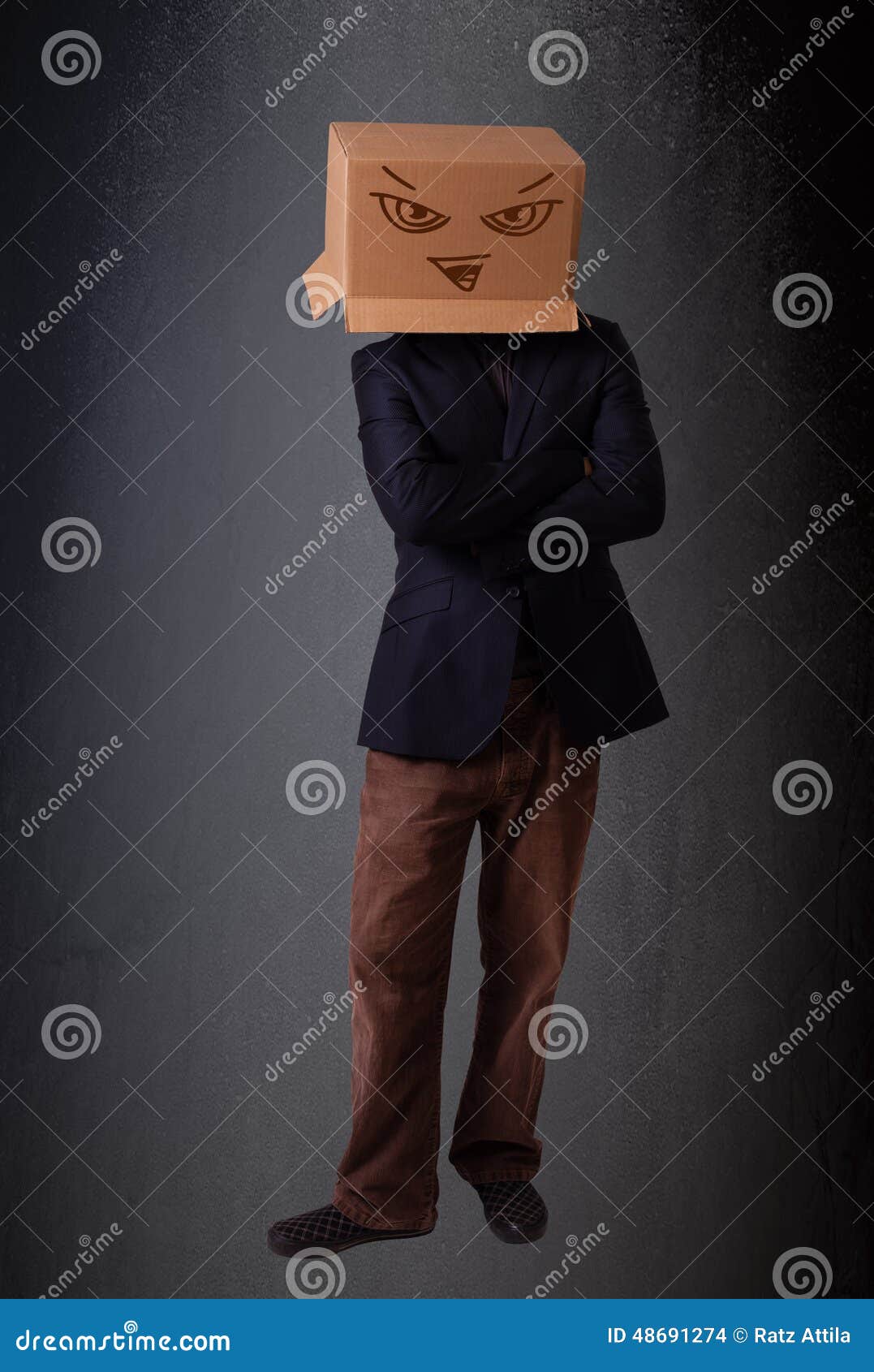 Young Man Gesturing with a Cardboard Box on His Head with Evil F Stock ...