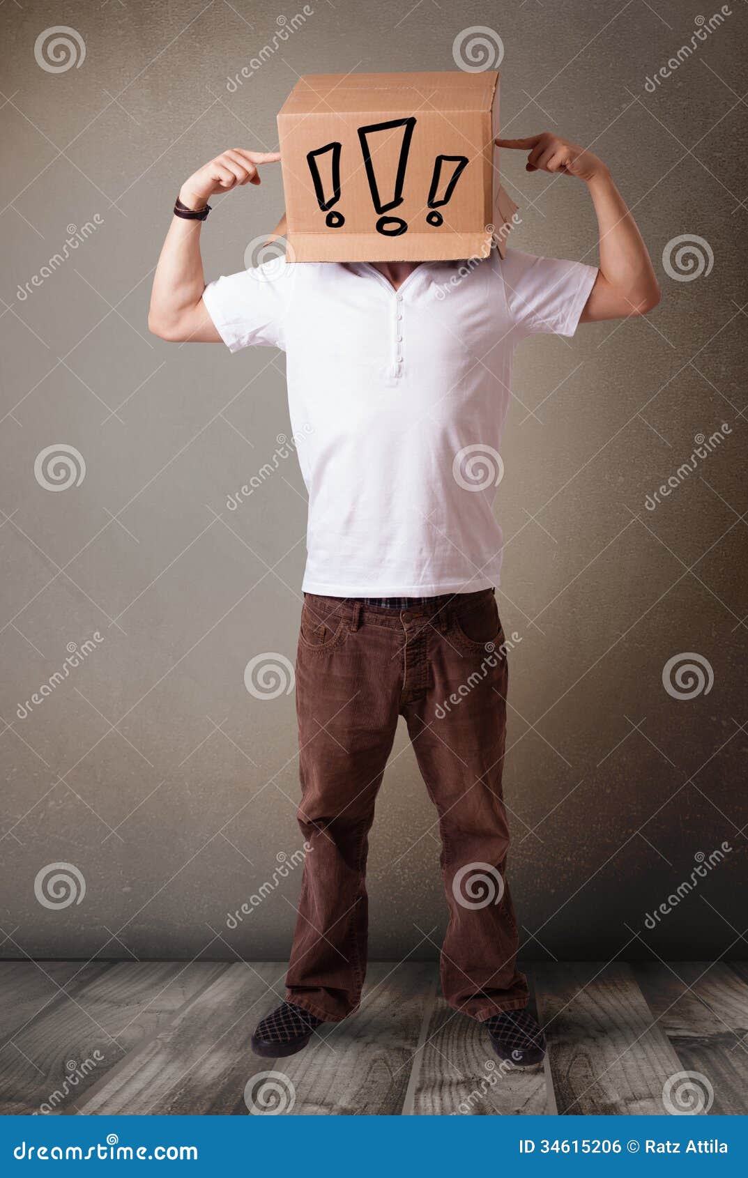 Young Man Gesturing with a Cardboard Box on His Head with Exclamation ...