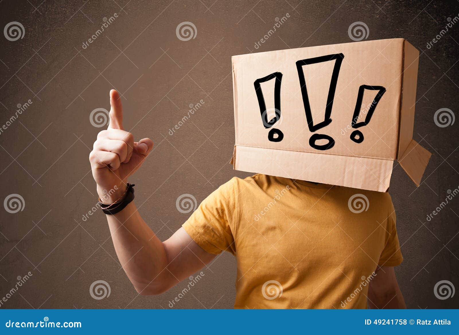Young Man Gesturing with a Cardboard Box on His Head with Exclamation ...