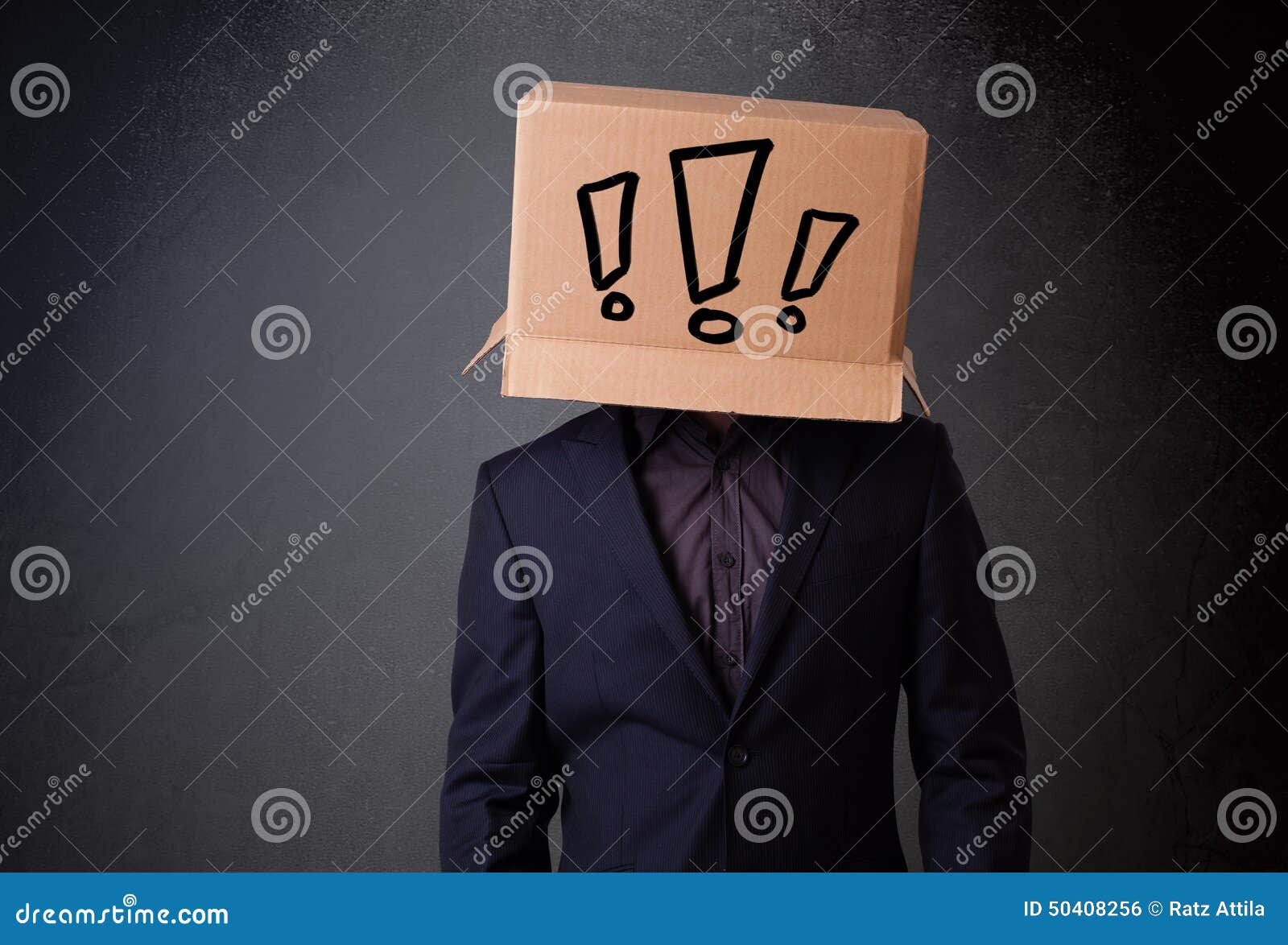 Young Man Gesturing with a Cardboard Box on His Head with Exclamation ...