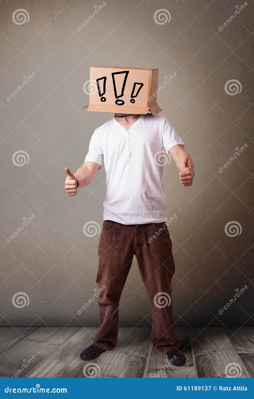 Young Man Gesturing with a Cardboard Box on His Head with Exclam Stock ...