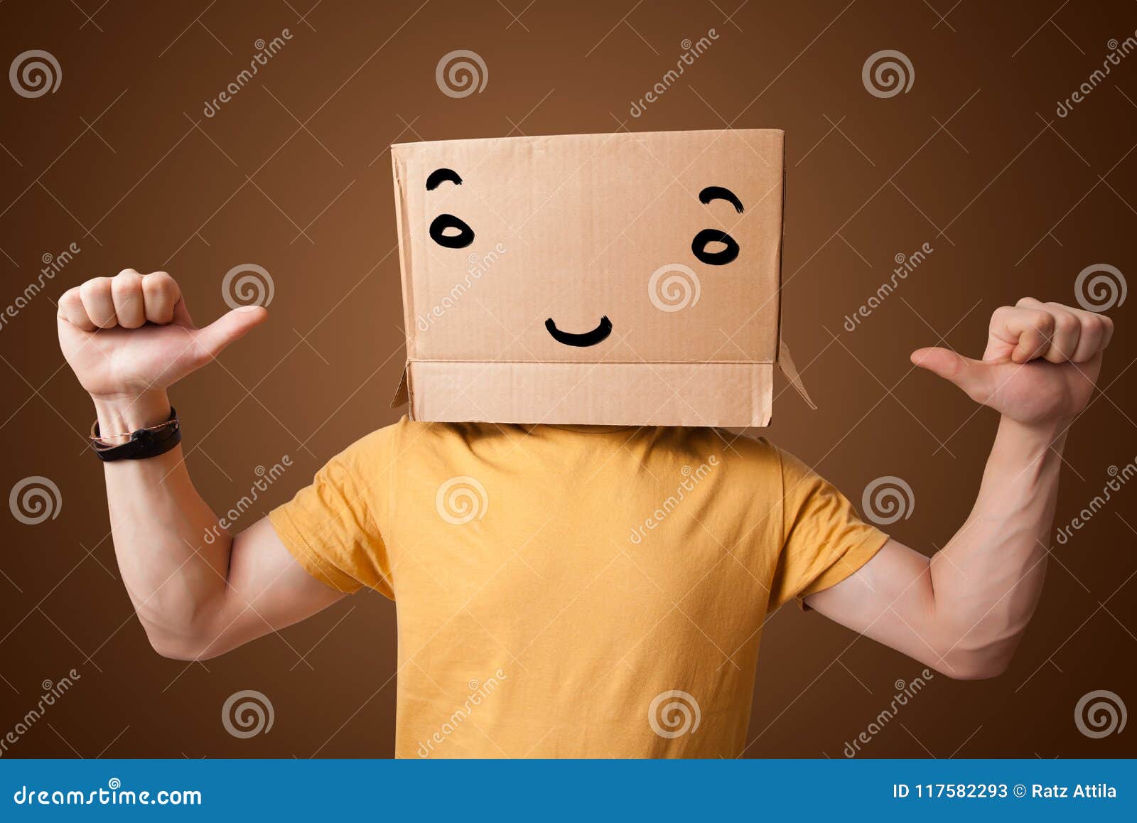 Young Man Gesturing with a Cardboard Box on His Head with Smiley Face ...