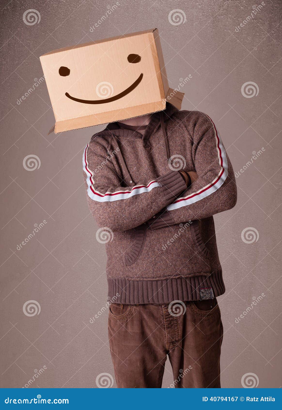 Young Man Gesturing with a Cardboard Box on His Head with Smiley Stock ...