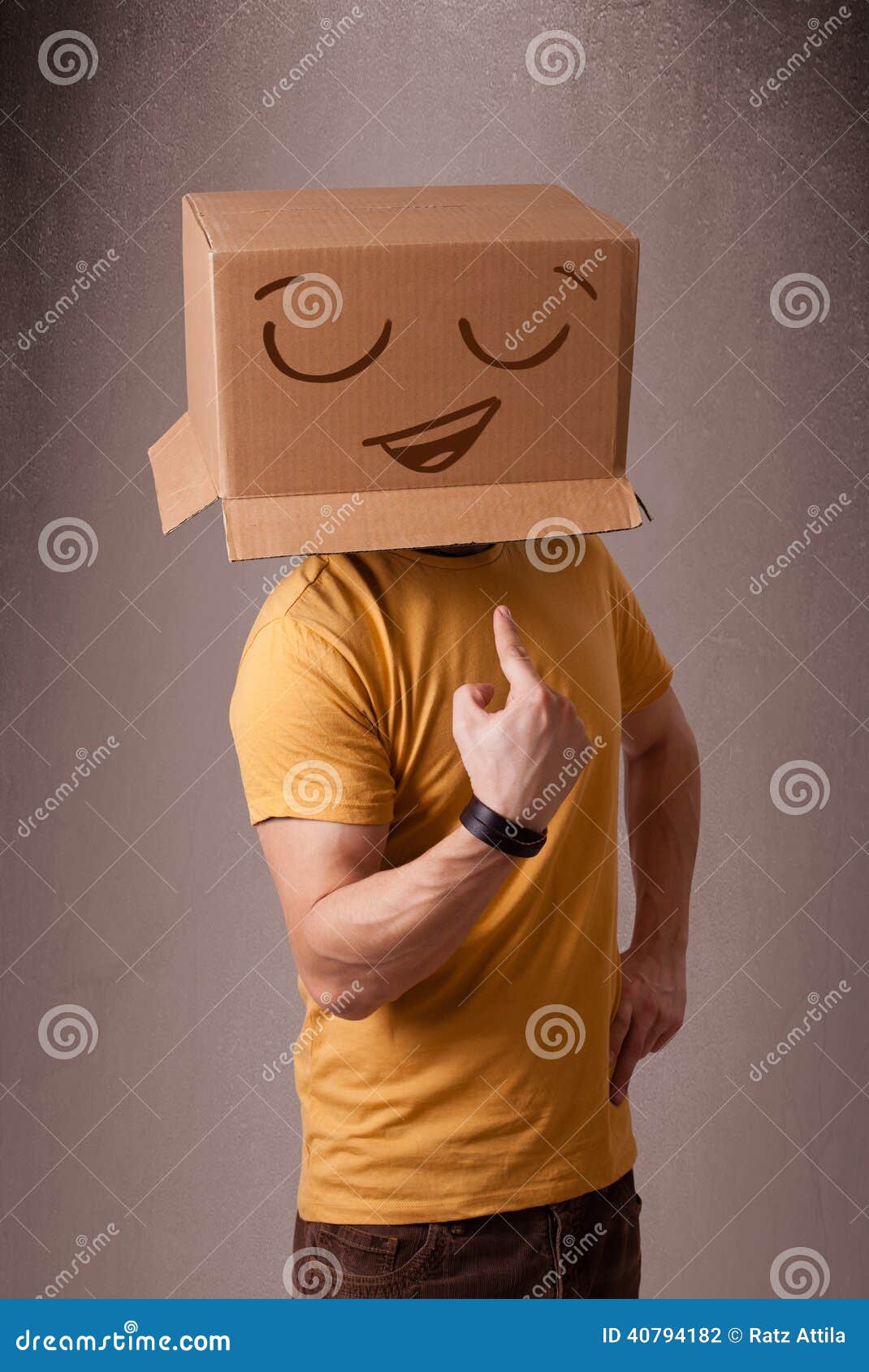 Young Man Gesturing with a Cardboard Box on His Head with Smiley Stock ...