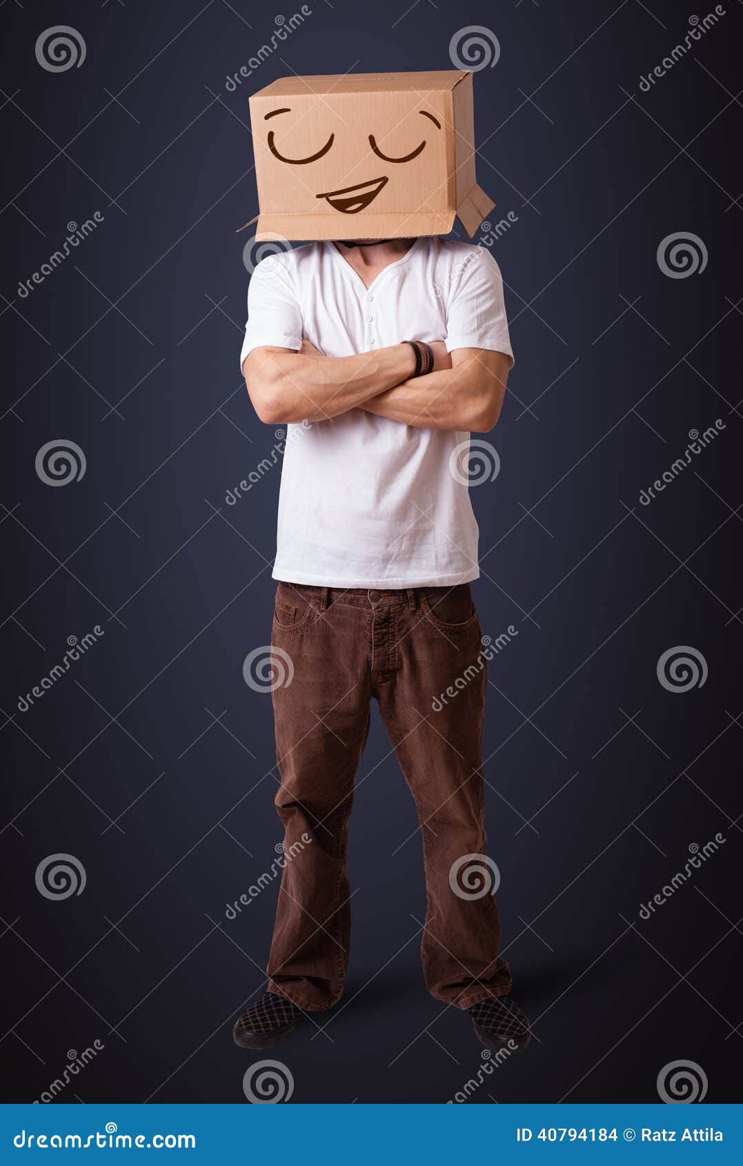 Young Man Gesturing with a Cardboard Box on His Head with Smiley Stock ...