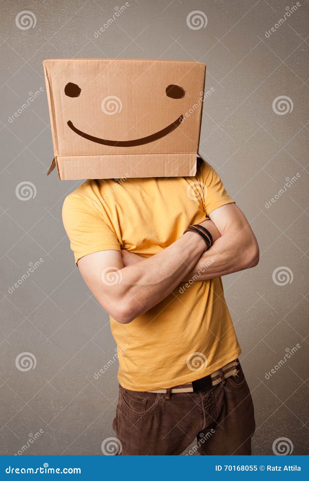 Young Man Gesturing with a Cardboard Box on His Head with Smiley Stock ...